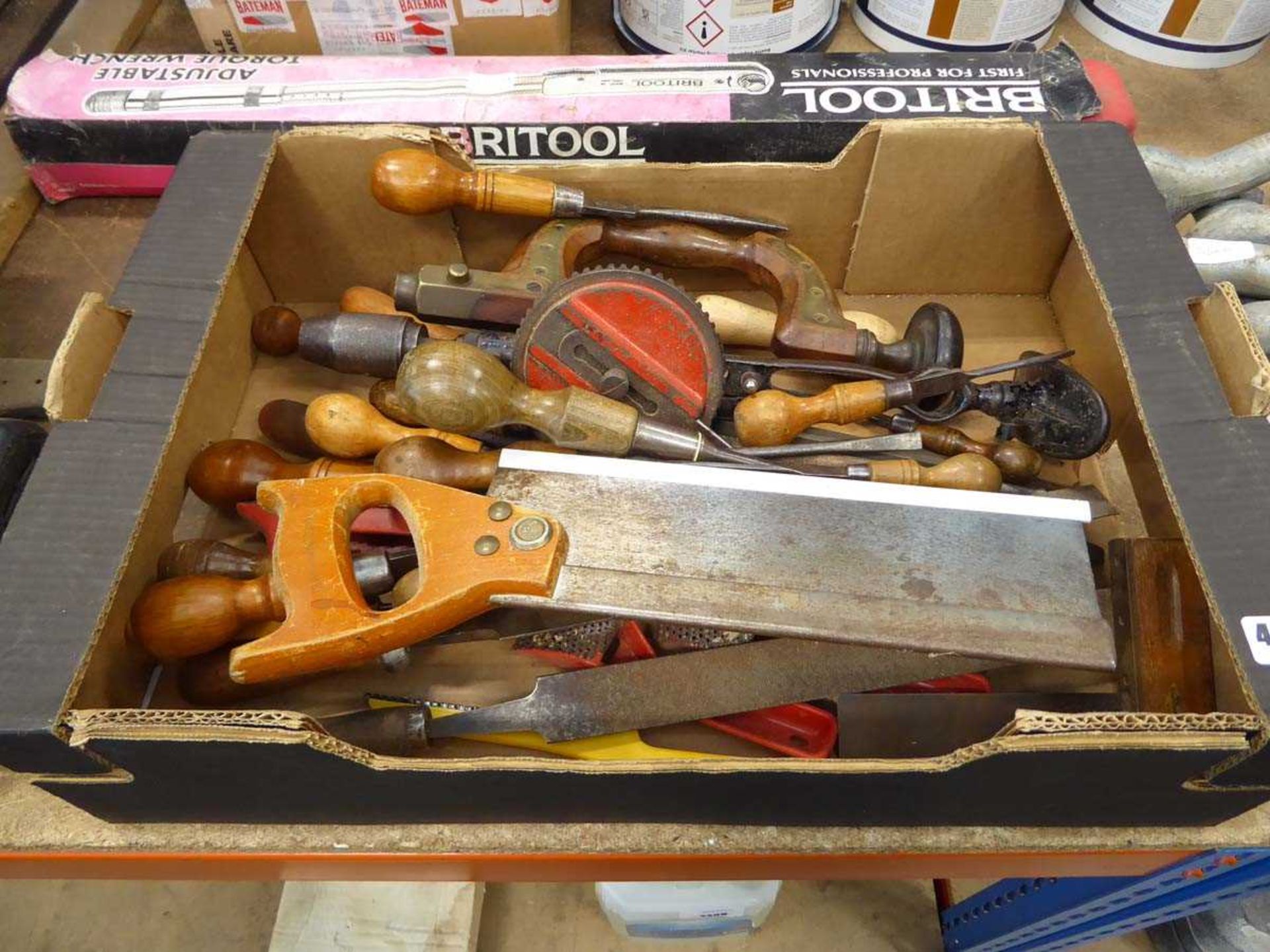 Box containing some woodwork equipment to include chisels, clamps, saws ...