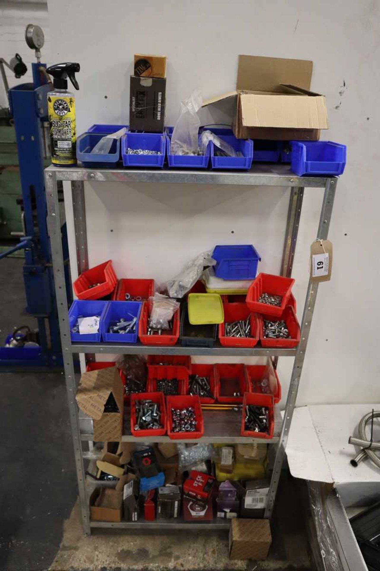 Rack of lin bins containing nuts, bolts, washers and other fixings ...