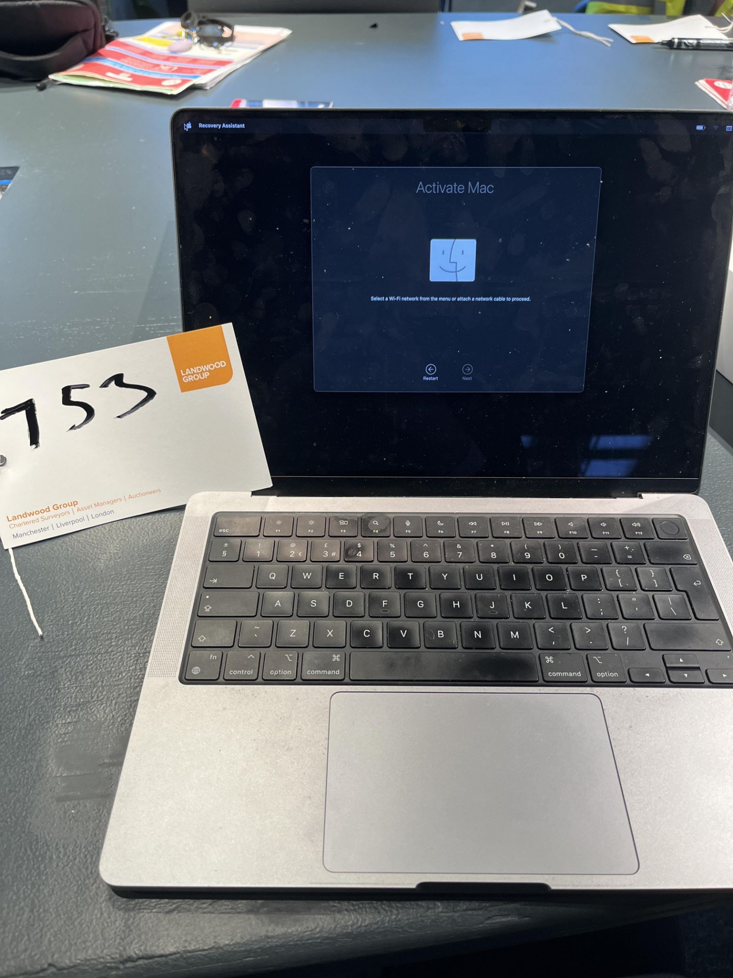 An Apple MacBook Pro 14in model a2442 with apple USB C charger and ...