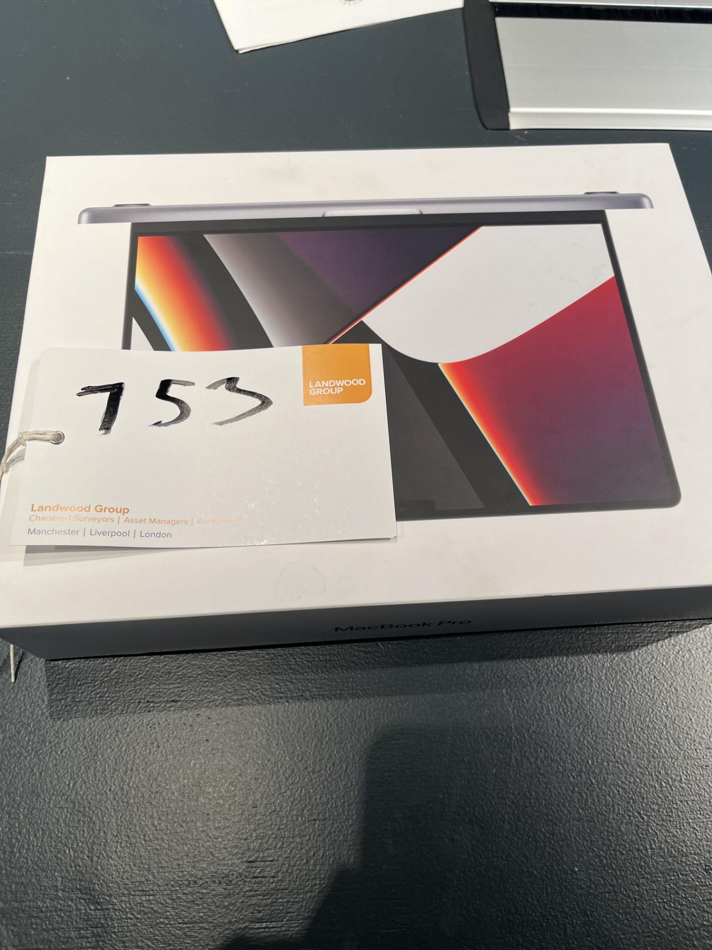 An Apple MacBook Pro 14in model a2442 with apple USB C charger and ...
