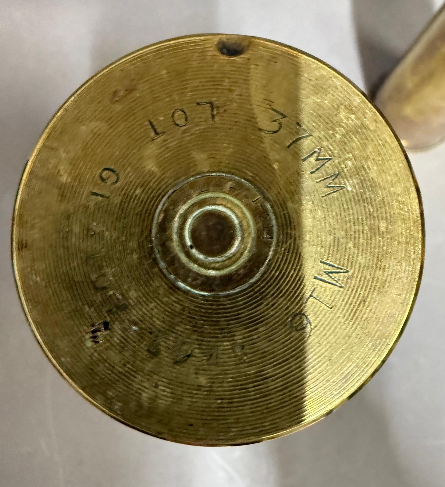 A pair of brass shell cases