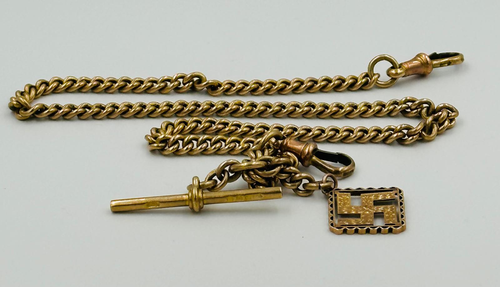 A 9ct gold T Bar watch chain, makers mark B & S with 9ct gold Hindu ...