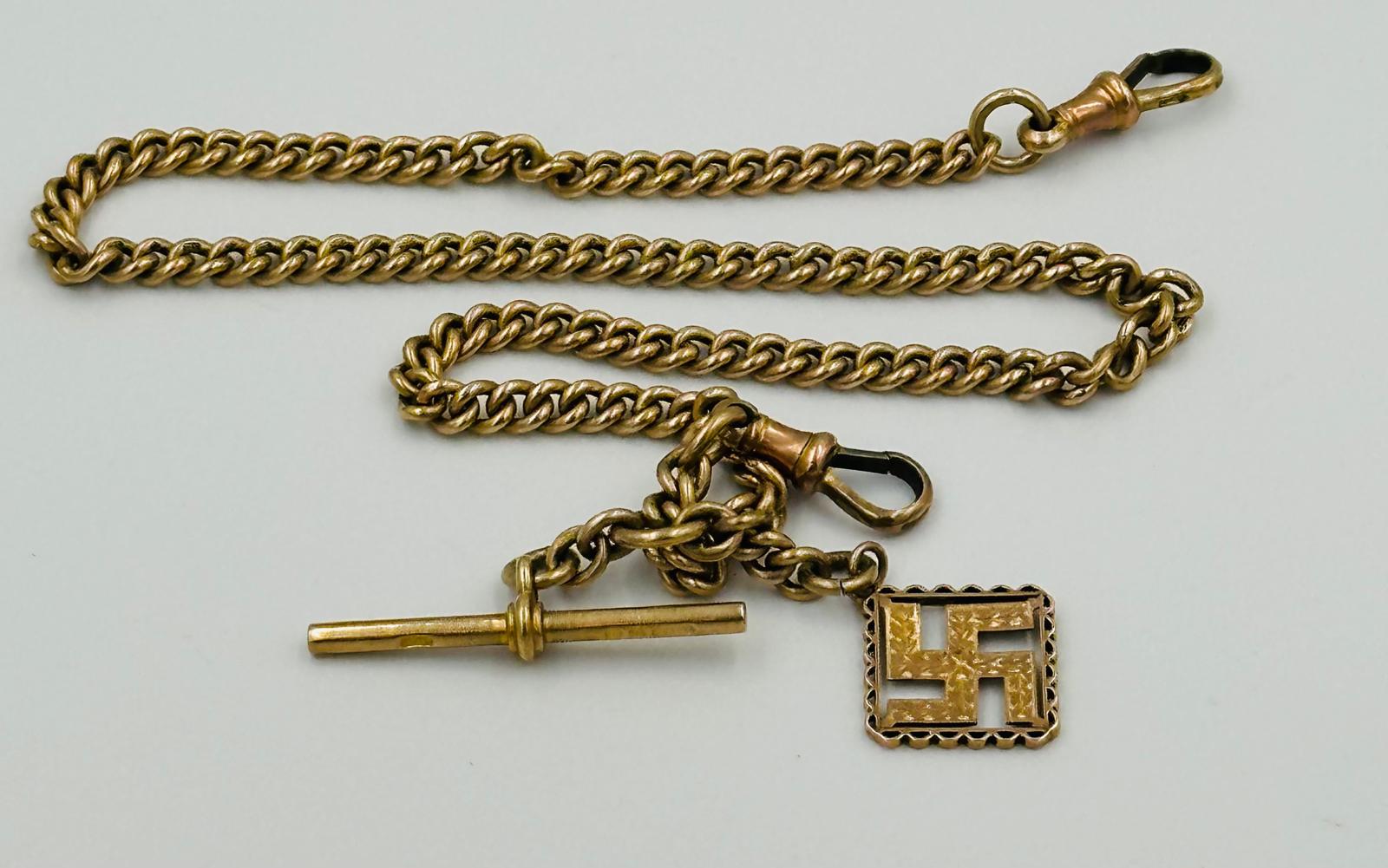 A 9ct gold T Bar watch chain, makers mark B & S with 9ct gold Hindu ...