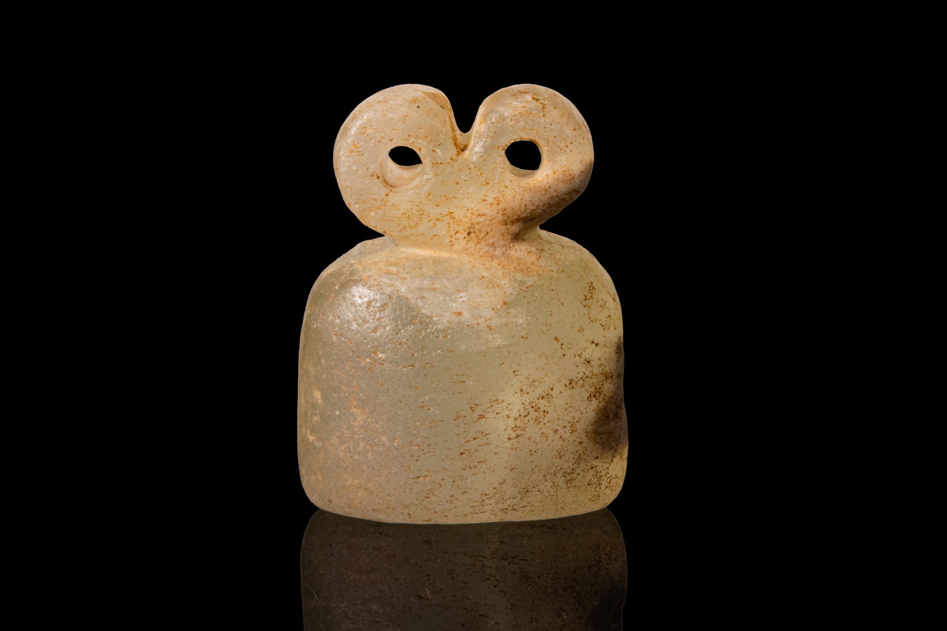 Ca. 3500 - 3000 BC A translucent stone eye idol with an oval base ...