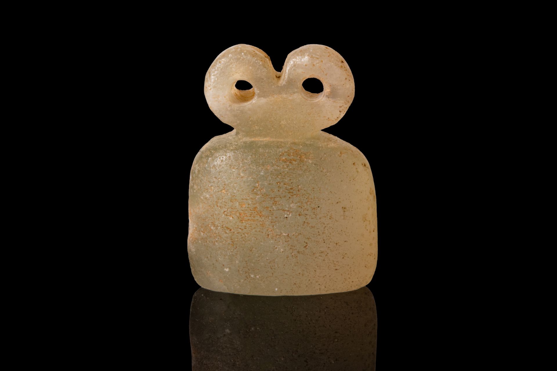 Ca. 3500 - 3000 BC A translucent stone eye idol with an oval base ...