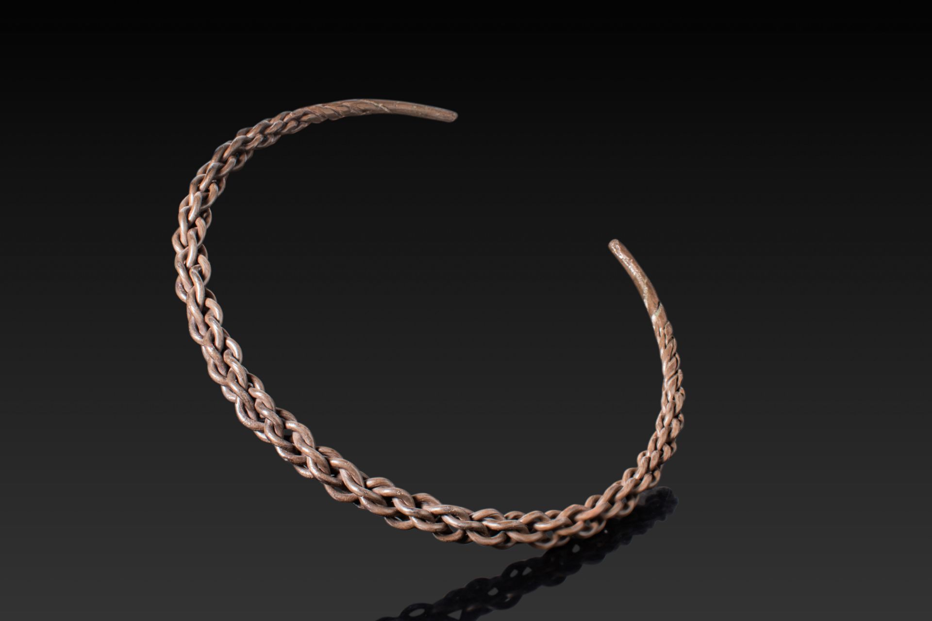 Ca. 600 - 300 BC A silver torque formed as an open hoop, the centre ...
