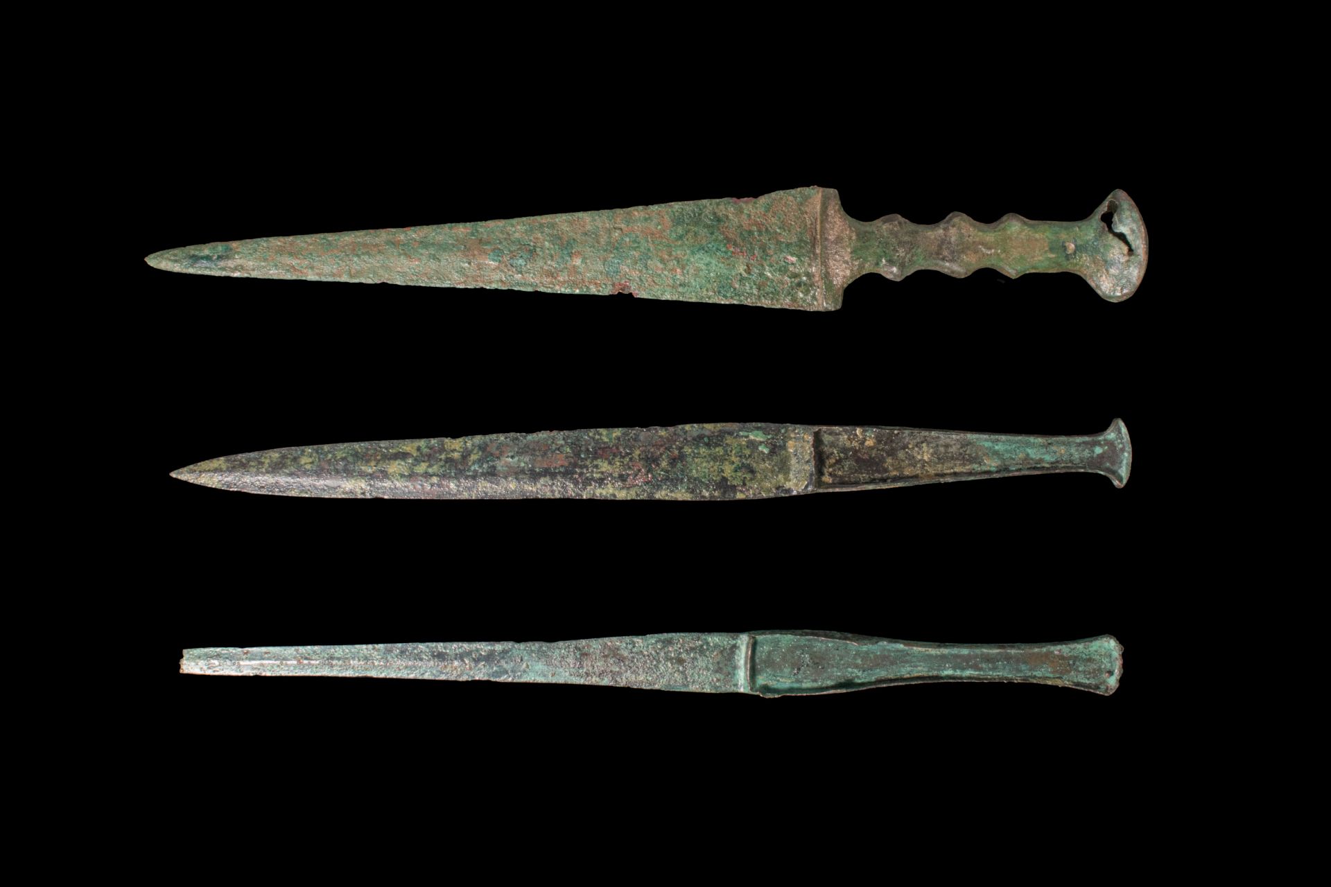 Ca. 1100 - 800 BC A collection of three bronze daggers, including, from ...