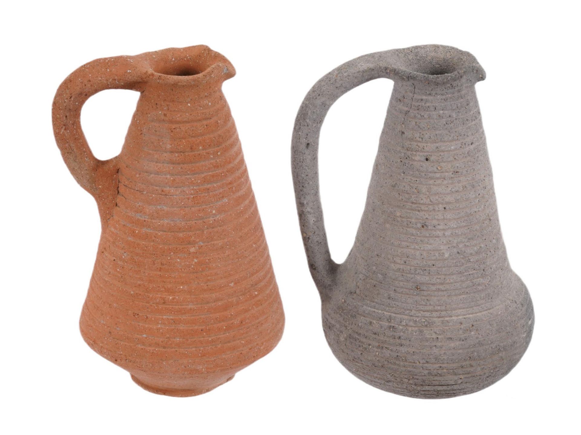 A pair of ancient Roman or Byzantine Empire terracotta pottery pitchers ...