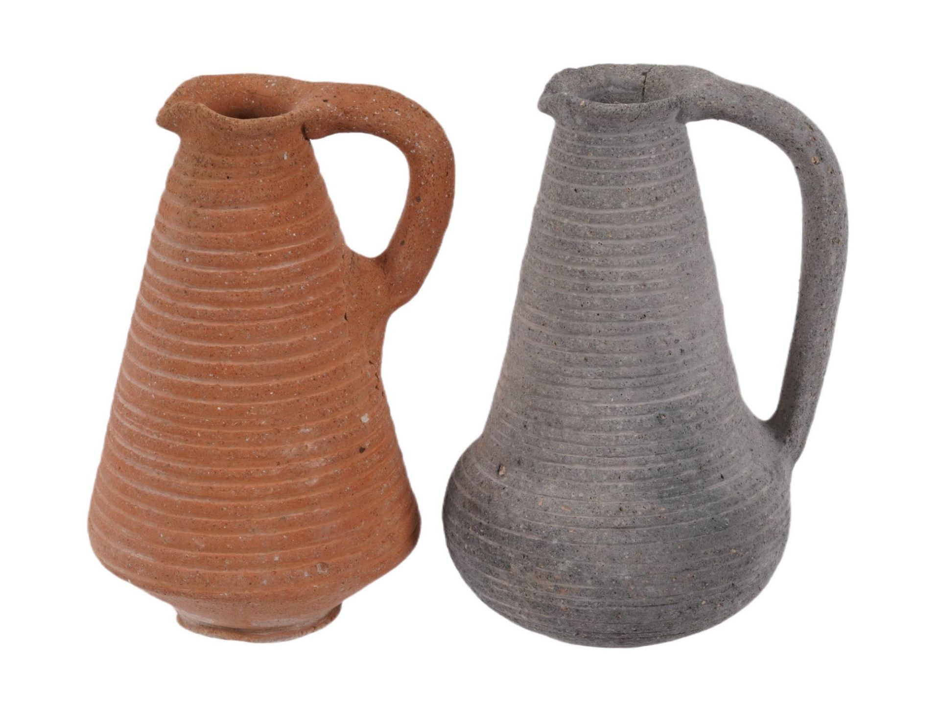 A pair of ancient Roman or Byzantine Empire terracotta pottery pitchers ...