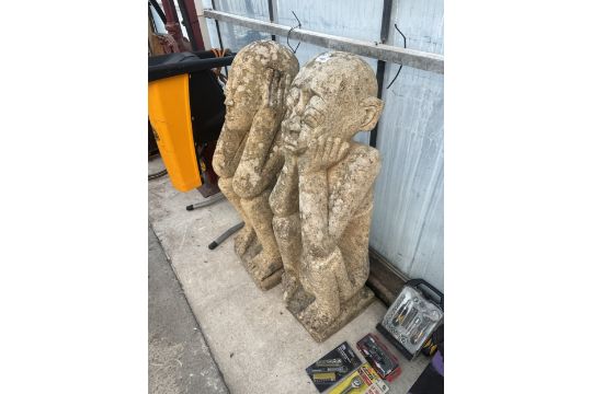 A PAIR OF LARGE CAST CONCRETE GREMLIN FIGURES (H:100CM)