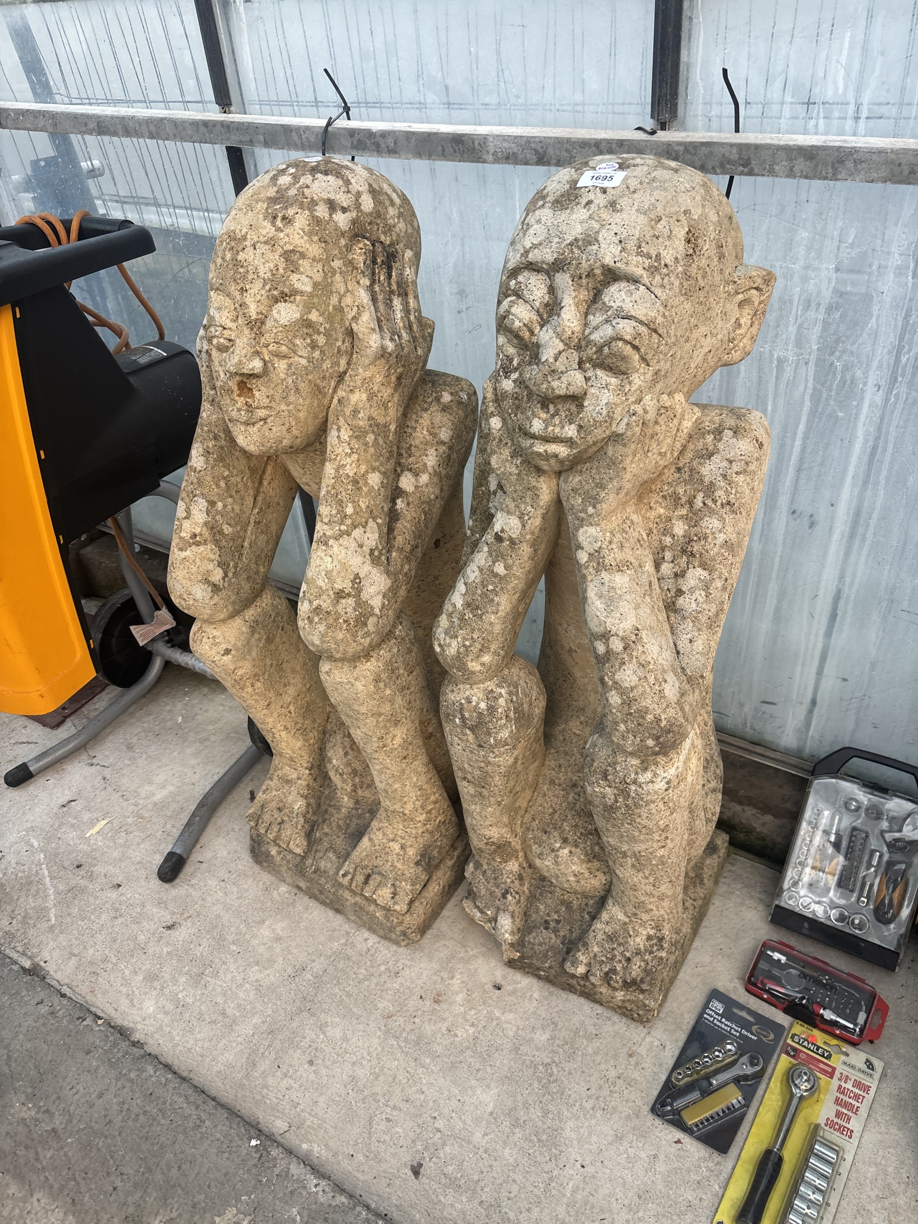 A PAIR OF LARGE CAST CONCRETE GREMLIN FIGURES (H:100CM)