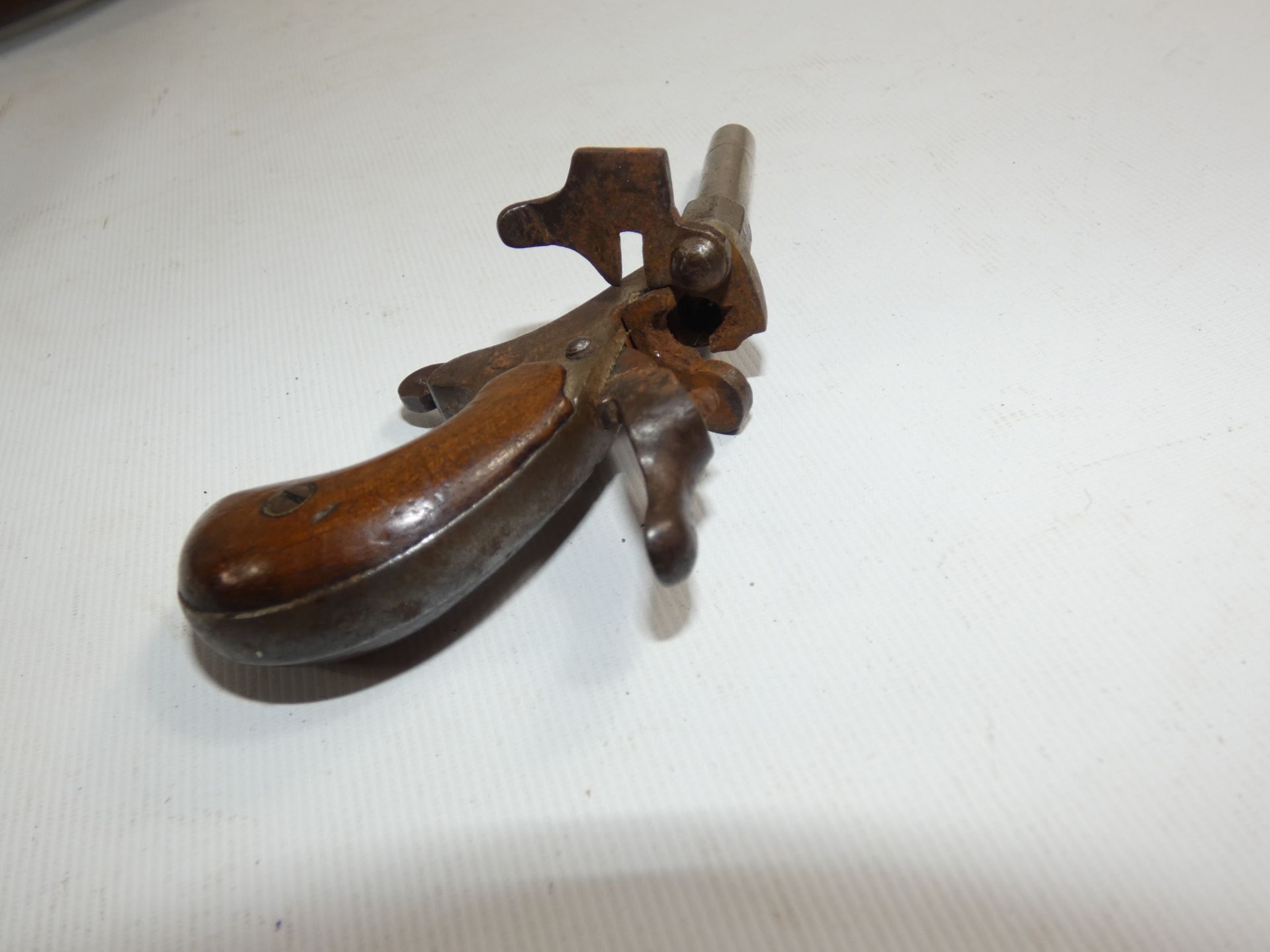 AN ANTIQUE BLANK FIRING POSTMANS/CYCLISTS RIMFIRE PISTOL, USED TO SCARE ...