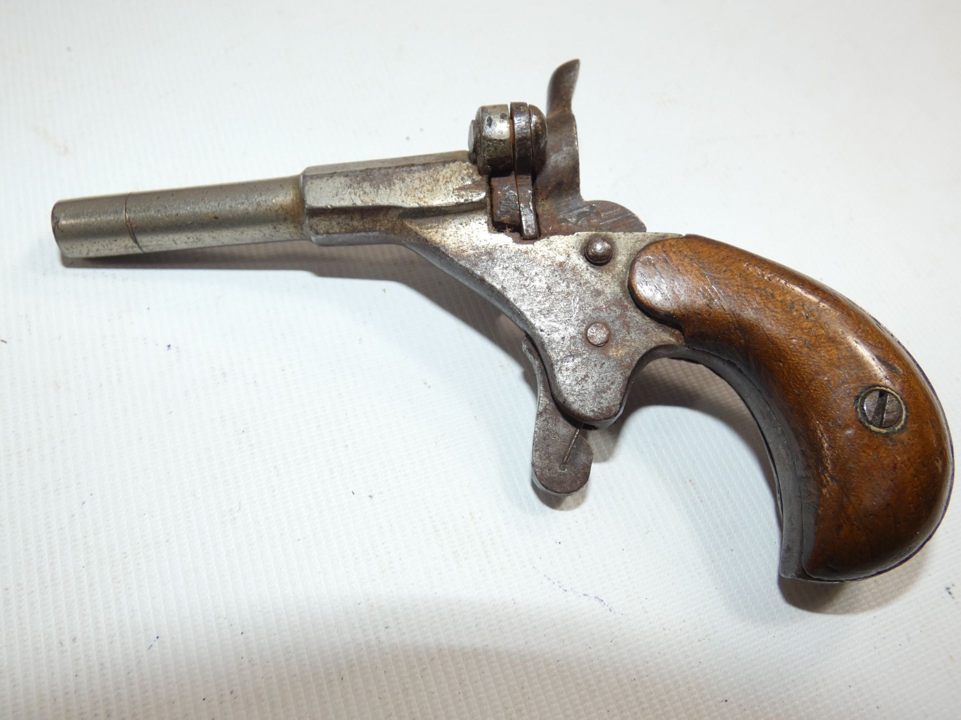 AN ANTIQUE BLANK FIRING POSTMANS/CYCLISTS RIMFIRE PISTOL, USED TO SCARE ...