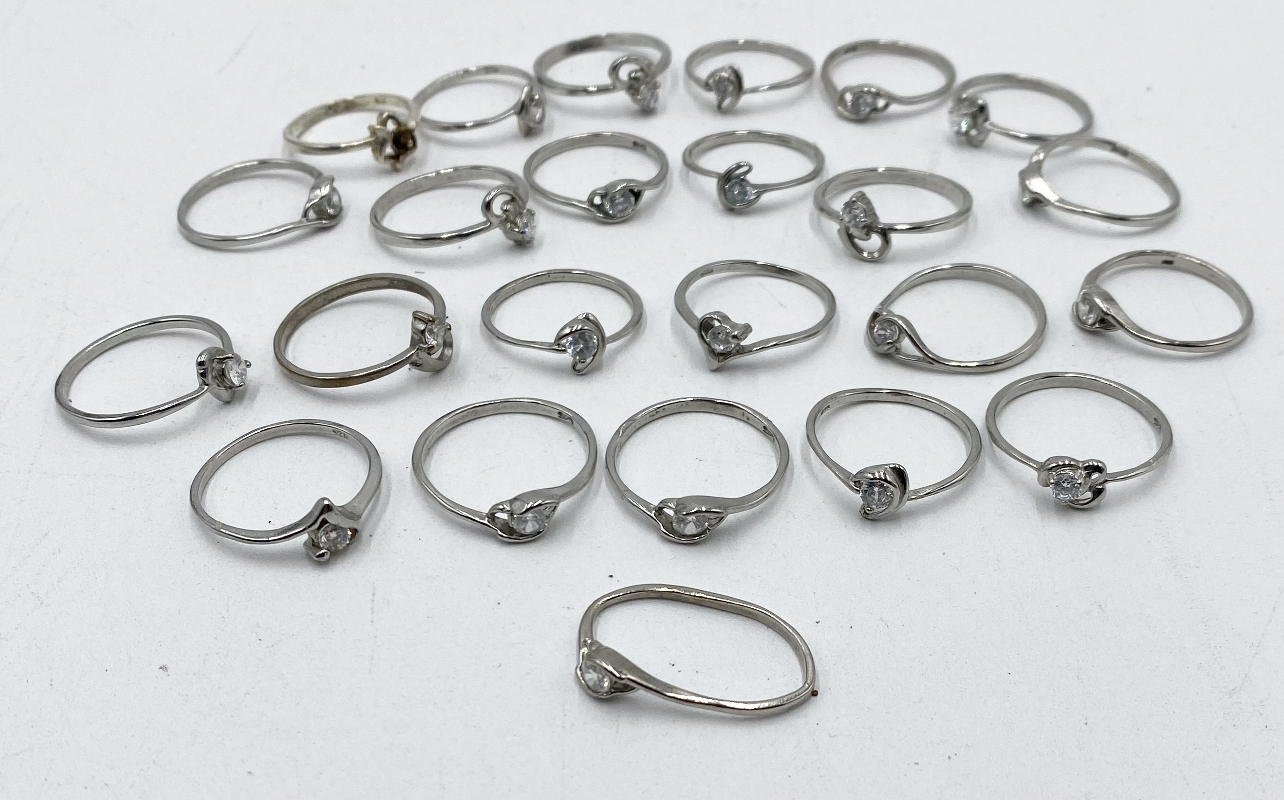 A collection of twenty four 925 silver gem set rings - two A/F