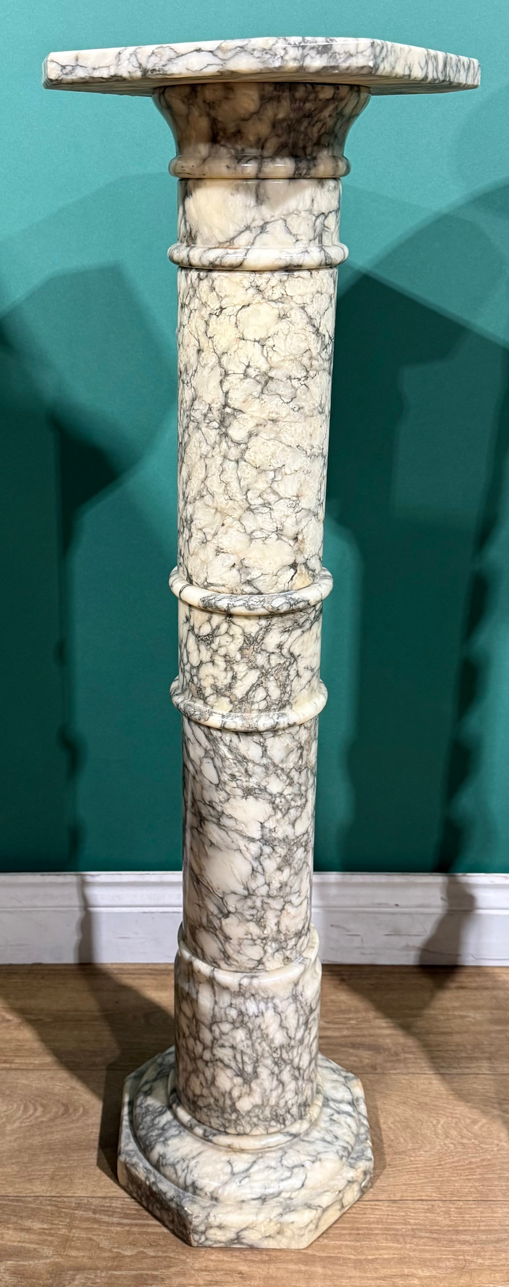 An alabaster column or statuary pedestal, canted square top, octagonal ...