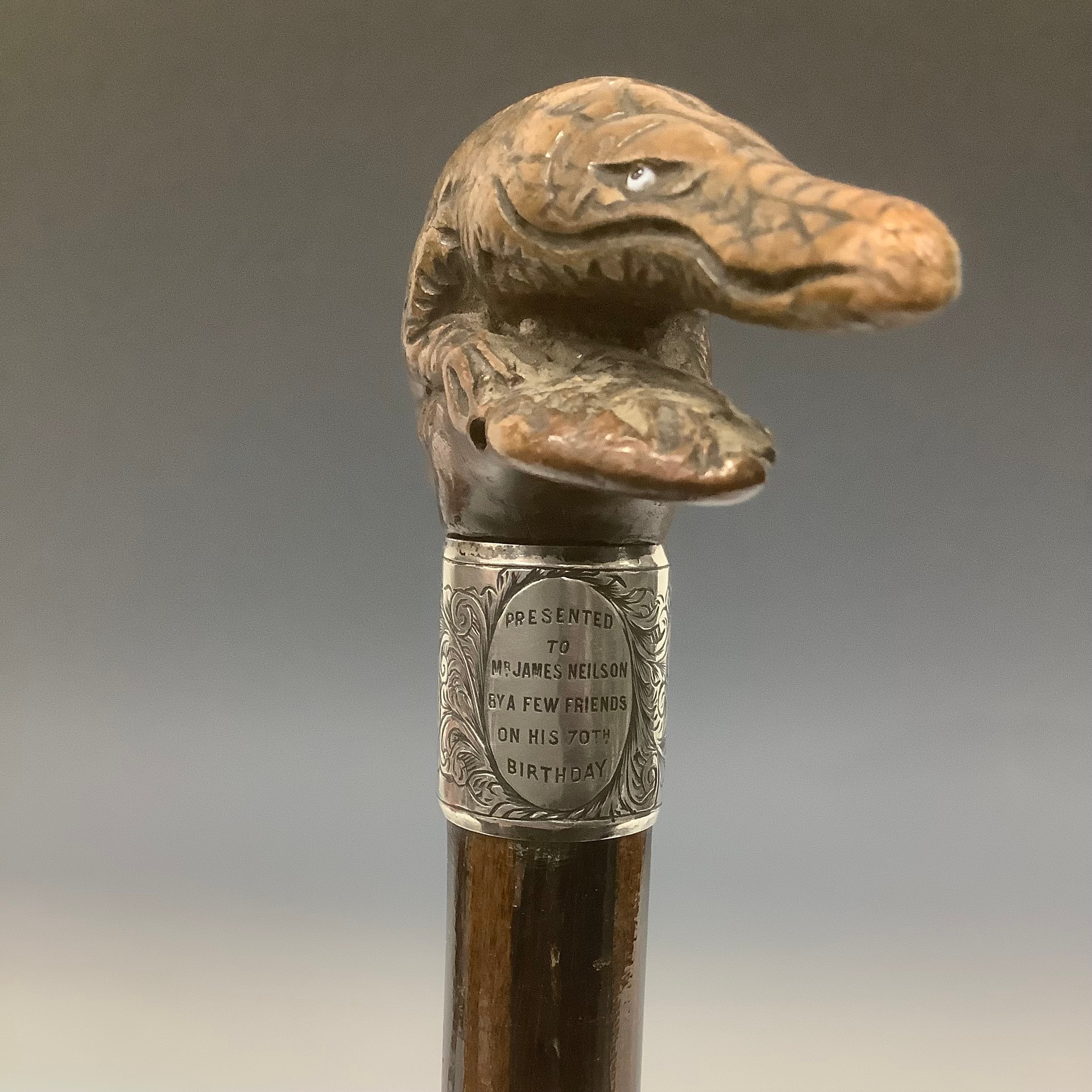 A Victorian silver mounted novelty walking cane, the hardwood handle ...