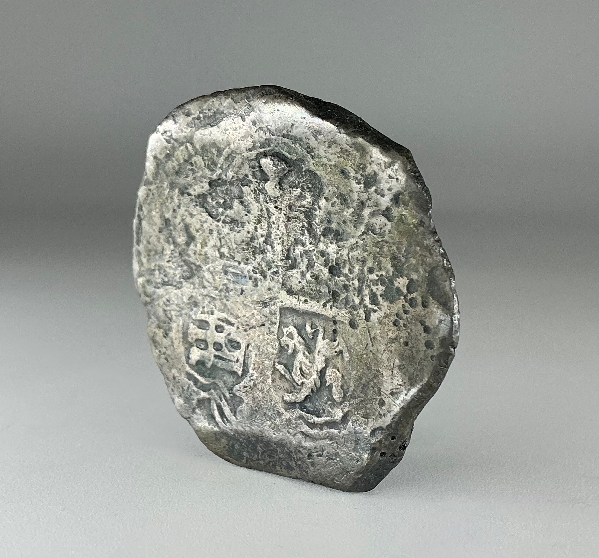 A 17th century piece of eight or eight Reales, within a Spink & Son box ...