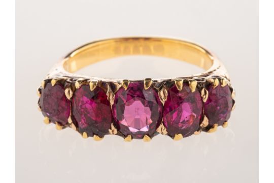A five stone ruby ring, claw set with five graduated oval-cut rubies ...
