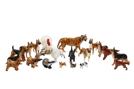 A collection of seventeen Beswick dogs. Including Poodle 2339, Corgi ...