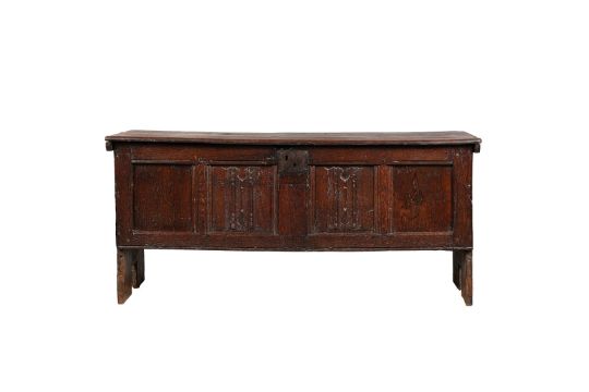 A 17TH CENTURY LINEN FOLD PLANK COFFER. The rectangular one piece top ...