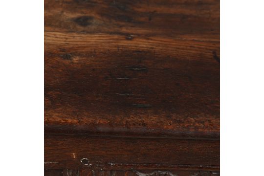 A 17TH CENTURY LINEN FOLD PLANK COFFER. The rectangular one piece top ...