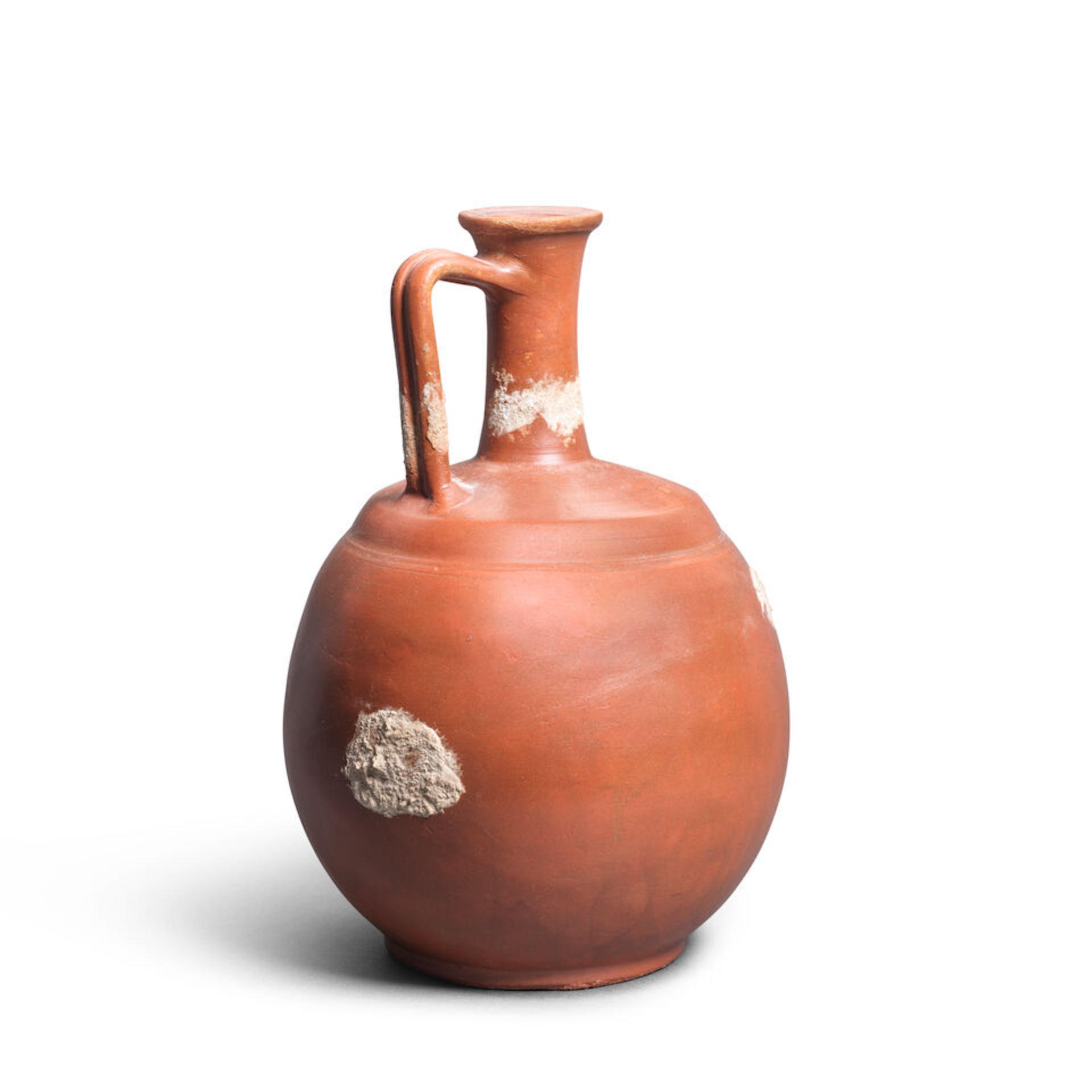 A Roman-style red slip ware jug 20th Century The narrow neck with ...