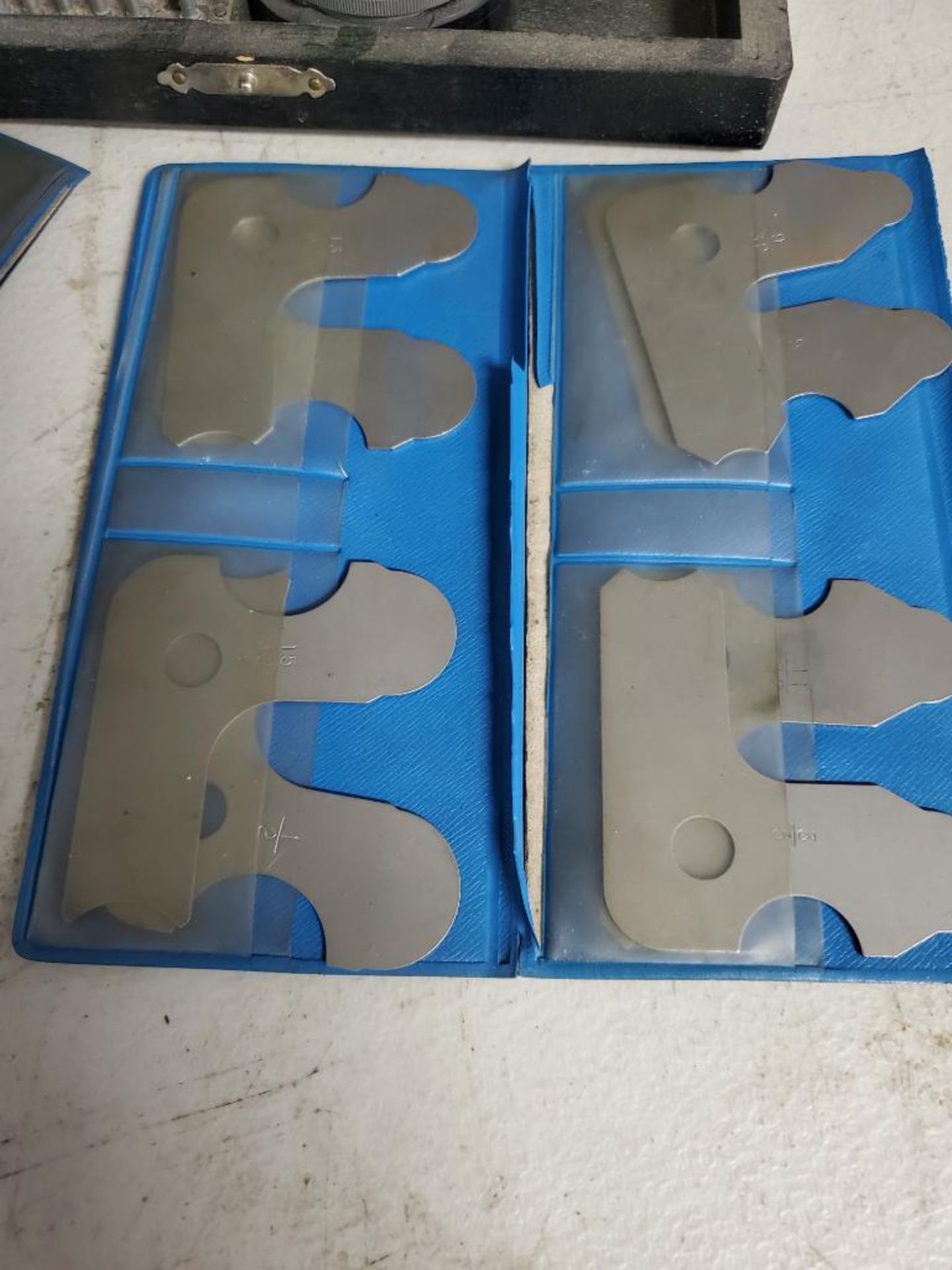 Assorted shim feeler gauges and Enco indicator.