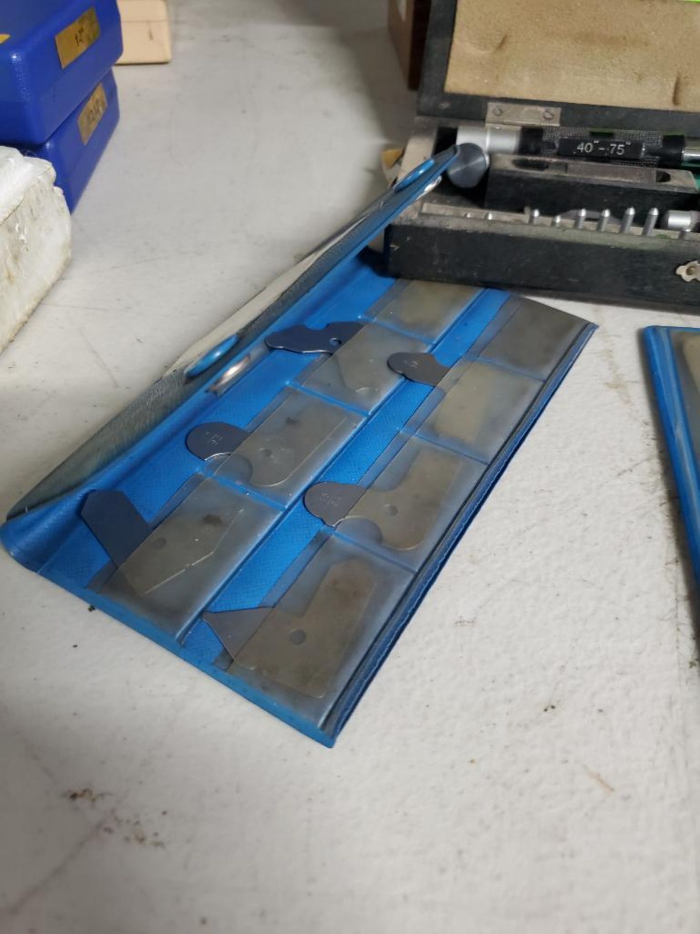 Assorted shim feeler gauges and Enco indicator.