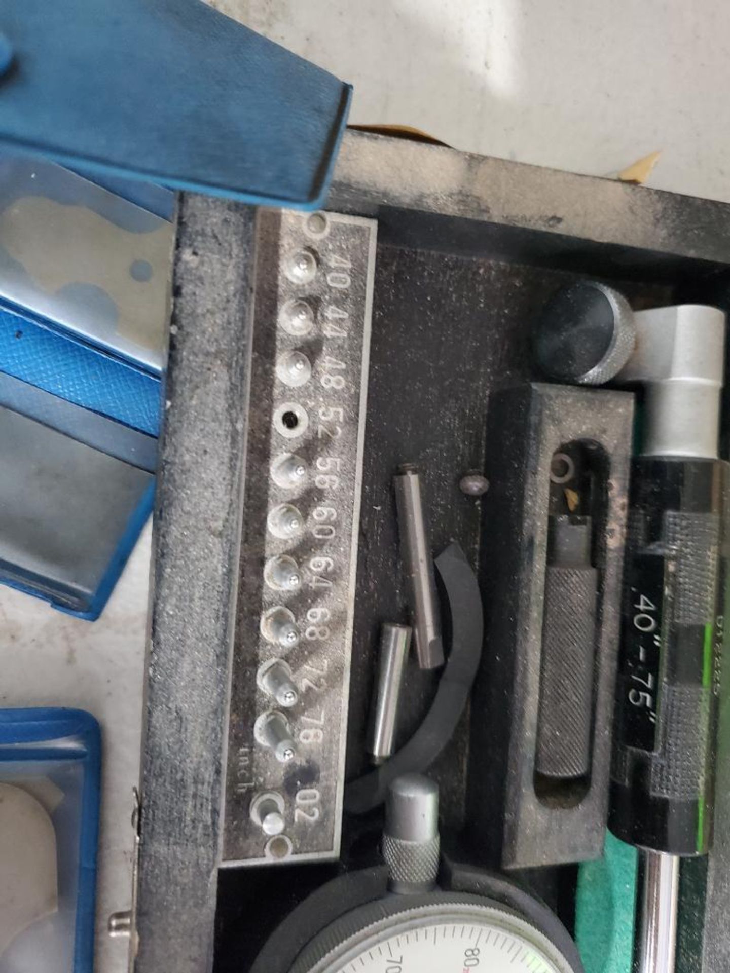 Assorted shim feeler gauges and Enco indicator.