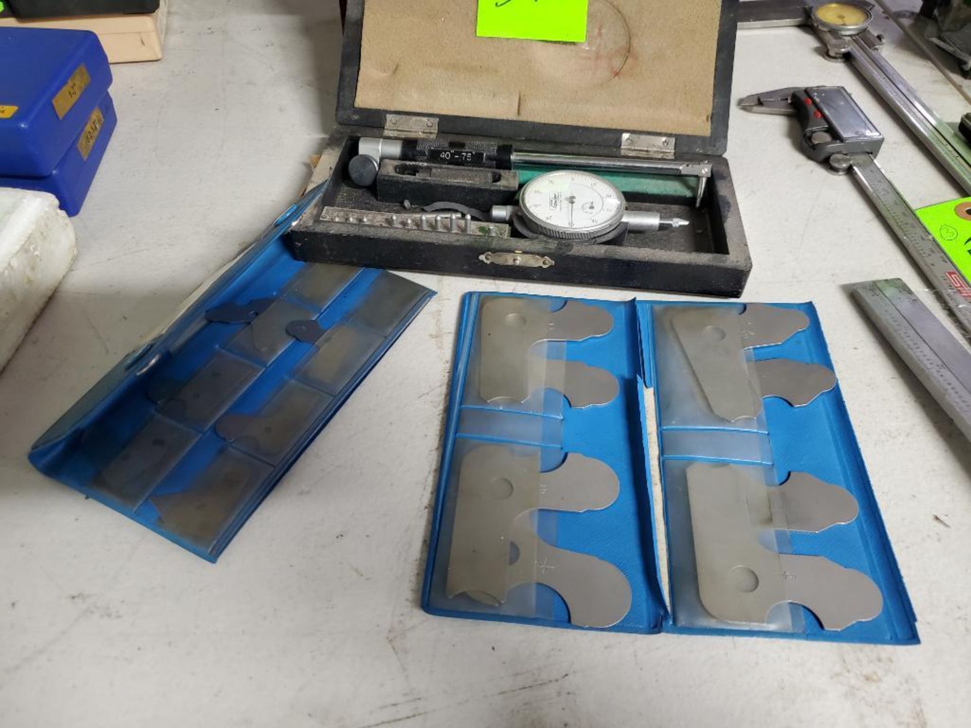 Assorted shim feeler gauges and Enco indicator.