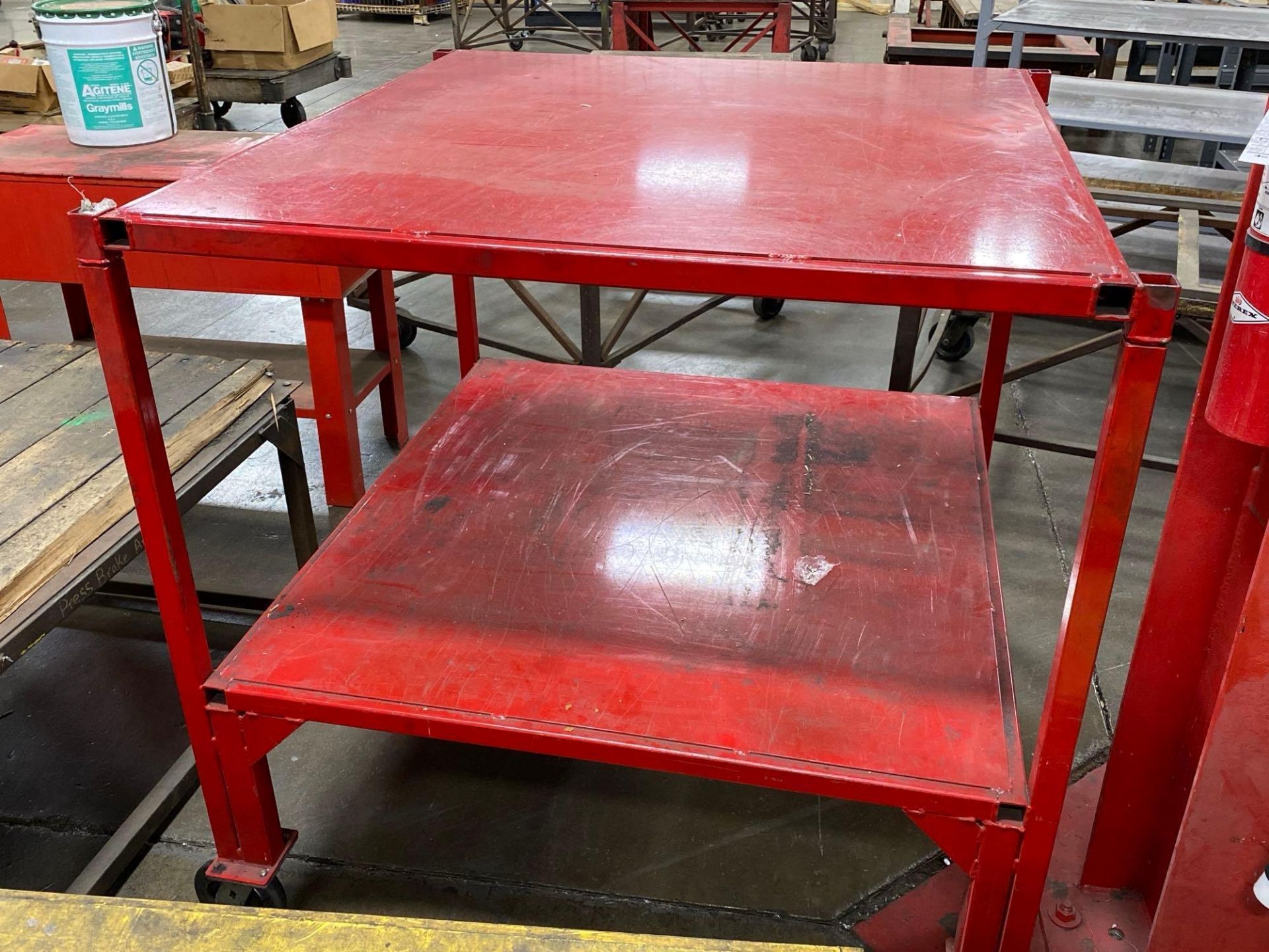 Lot of (2) Steel Tables 44" x 48" on wheels The top shelf will come off ...