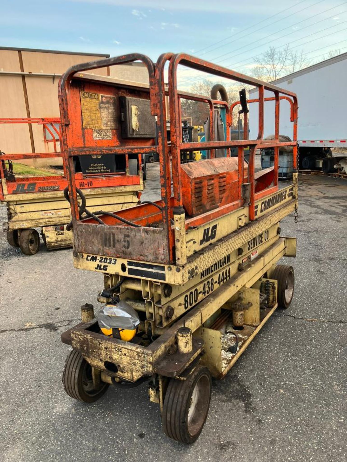 { Choice of lots: 186, 187, 188 } JLG Commander Scissor Lift, Model CM ...