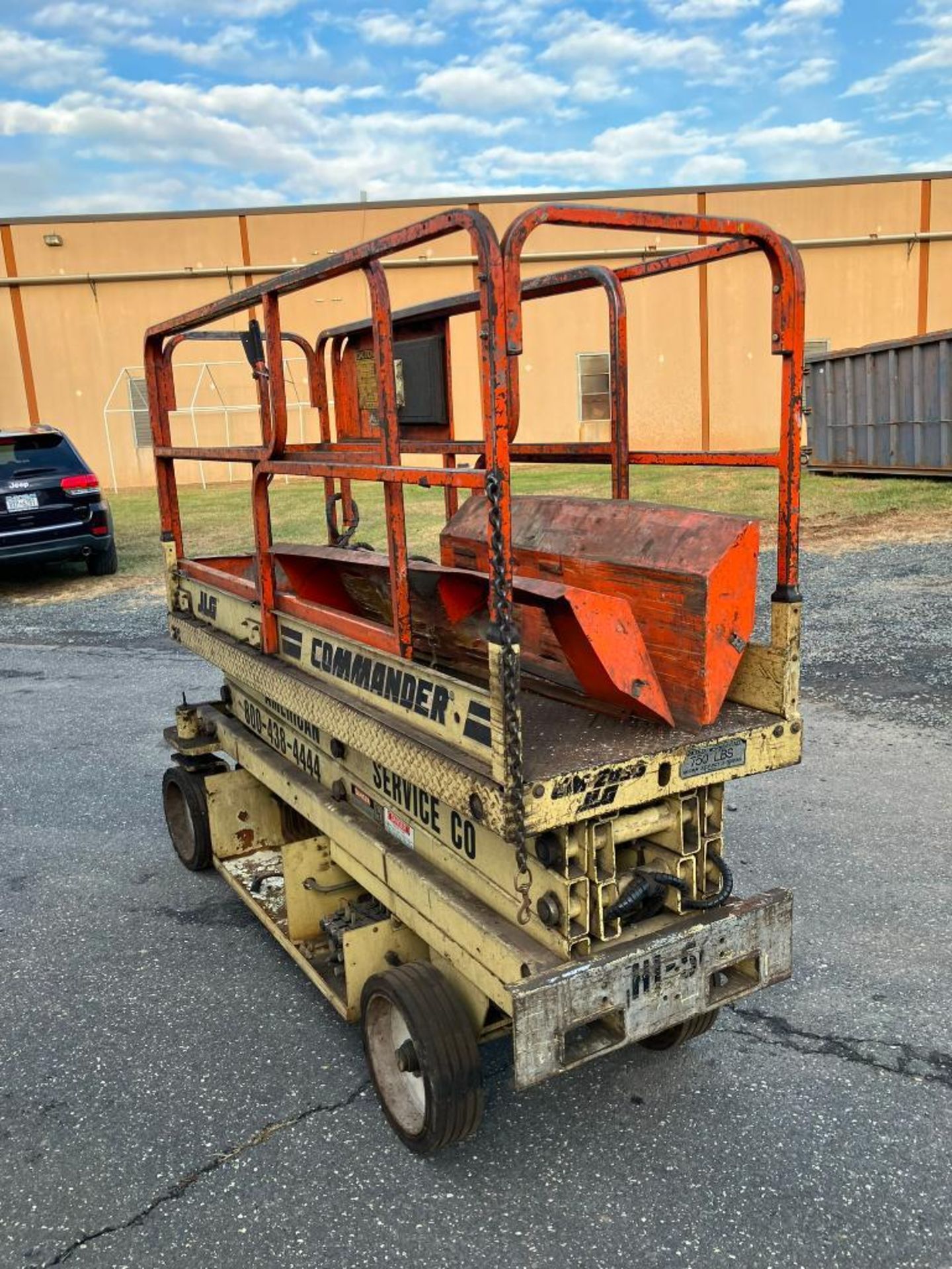 { Choice of lots: 186, 187, 188 } JLG Commander Scissor Lift, Model CM ...