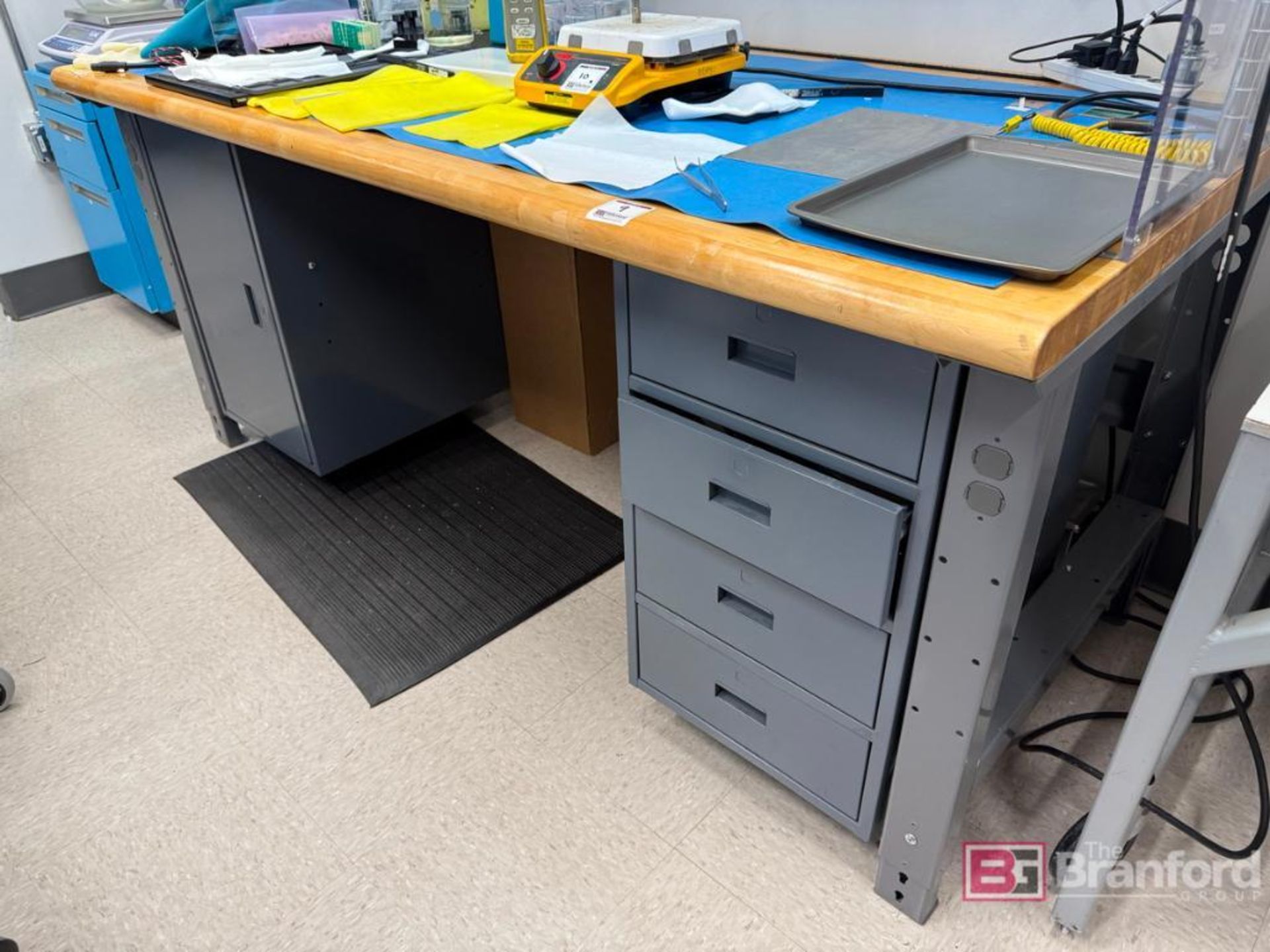 Six foot Uline Work Bench; w/ side cabinets. w/ Meto Shelf. Contents ...