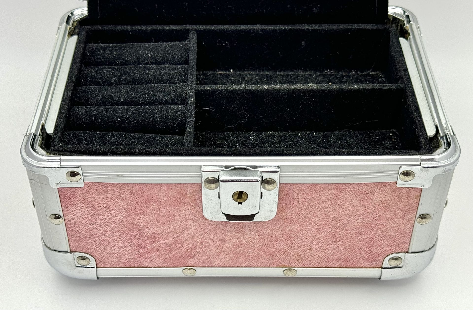 A beautiful pink textured rectangular travel jewellery box with mirror ...