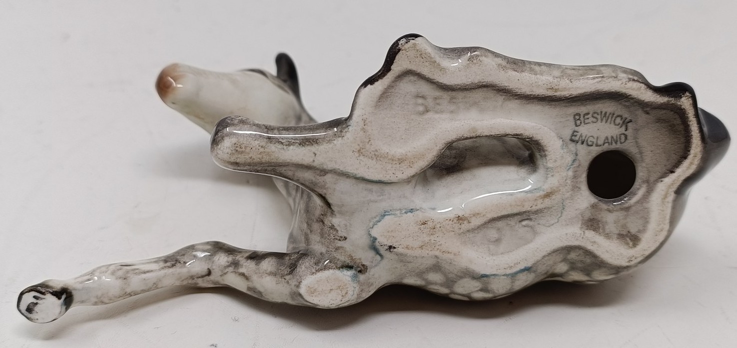 A Beswick Foal, lying, rockinghorse grey, 915, glossNo visible damage ...