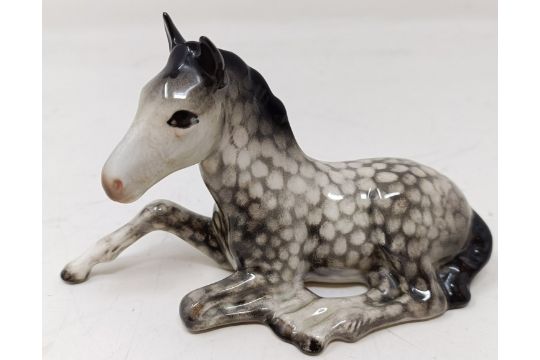 A Beswick Foal, lying, rockinghorse grey, 915, glossNo visible damage ...