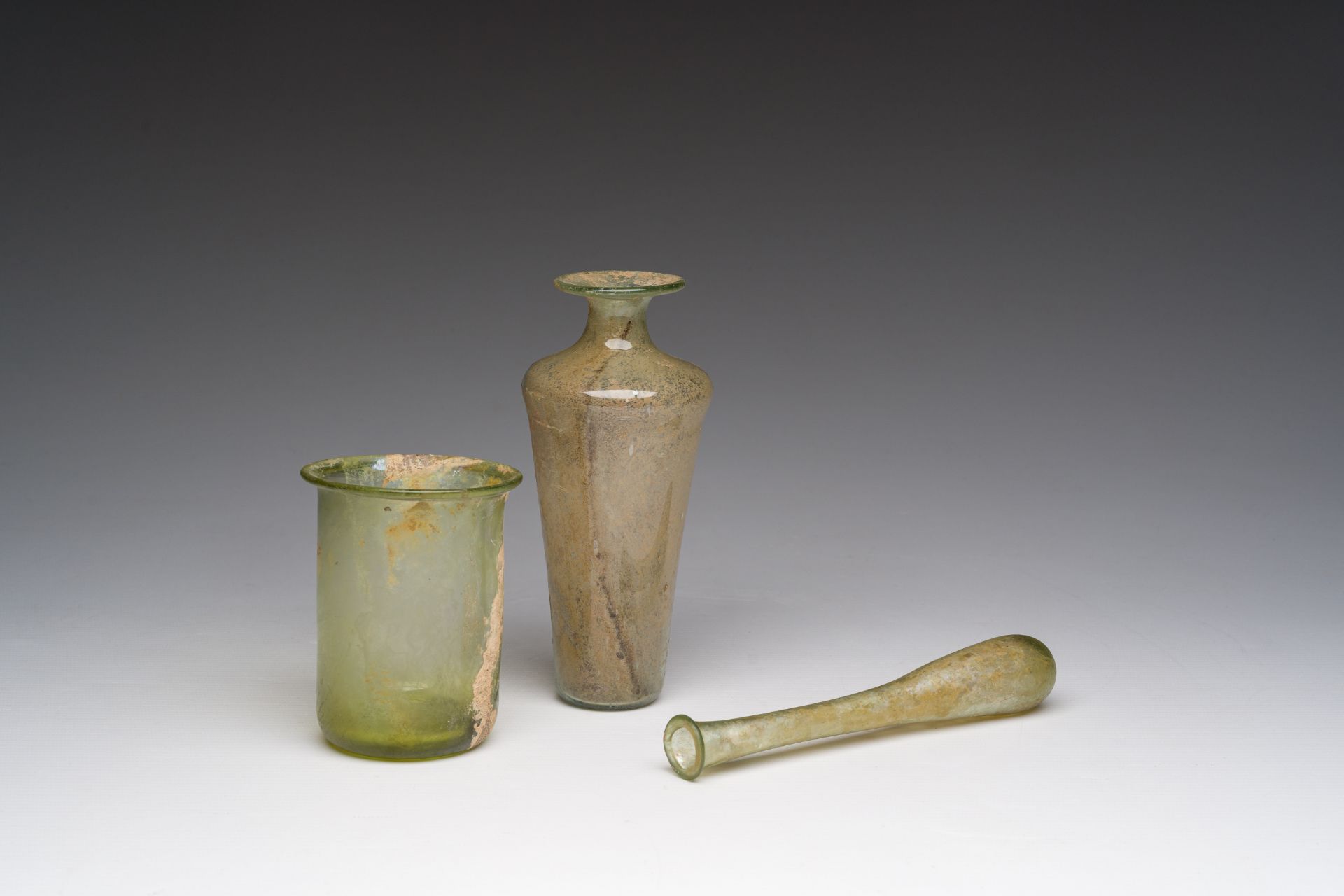 Three Roman glass flasks, 1st/4th C.H 15,5 - 9 cm (the tallest and the ...