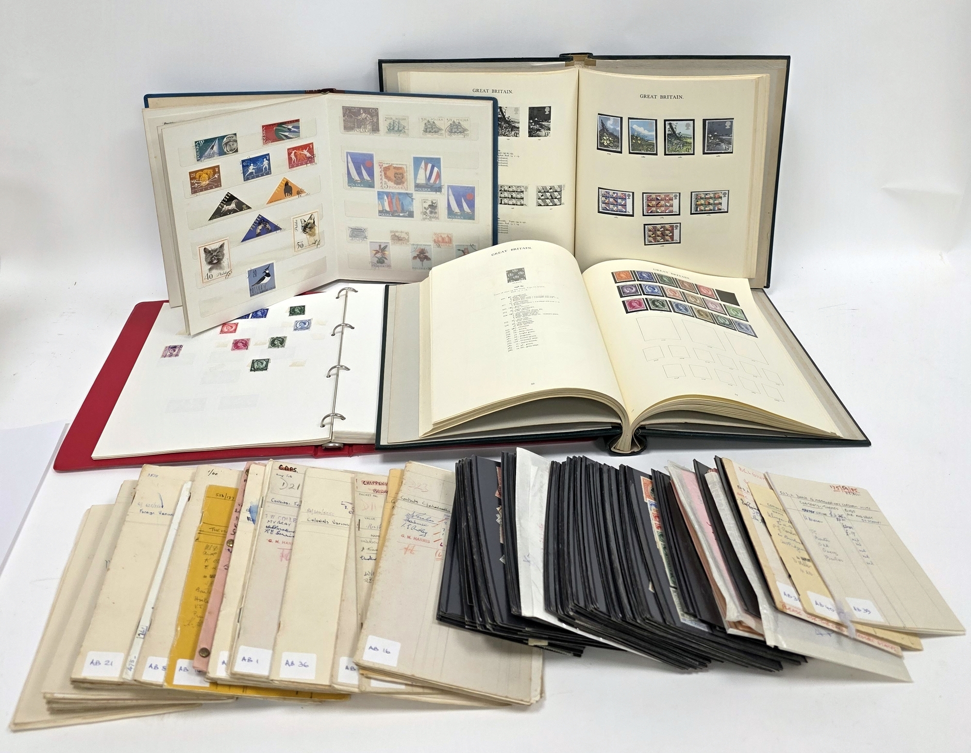 Collection of stamps including two partially filled Stanley Gibbons ...