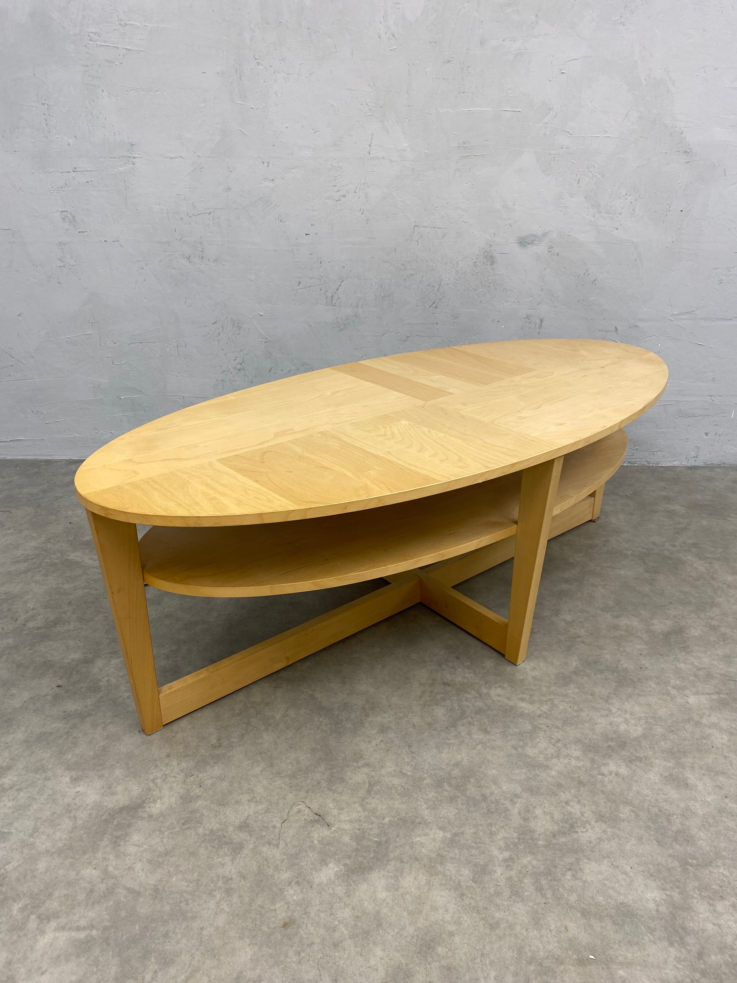 A contemporary birch Ikea Vejmon coffee table with oval figured top ...