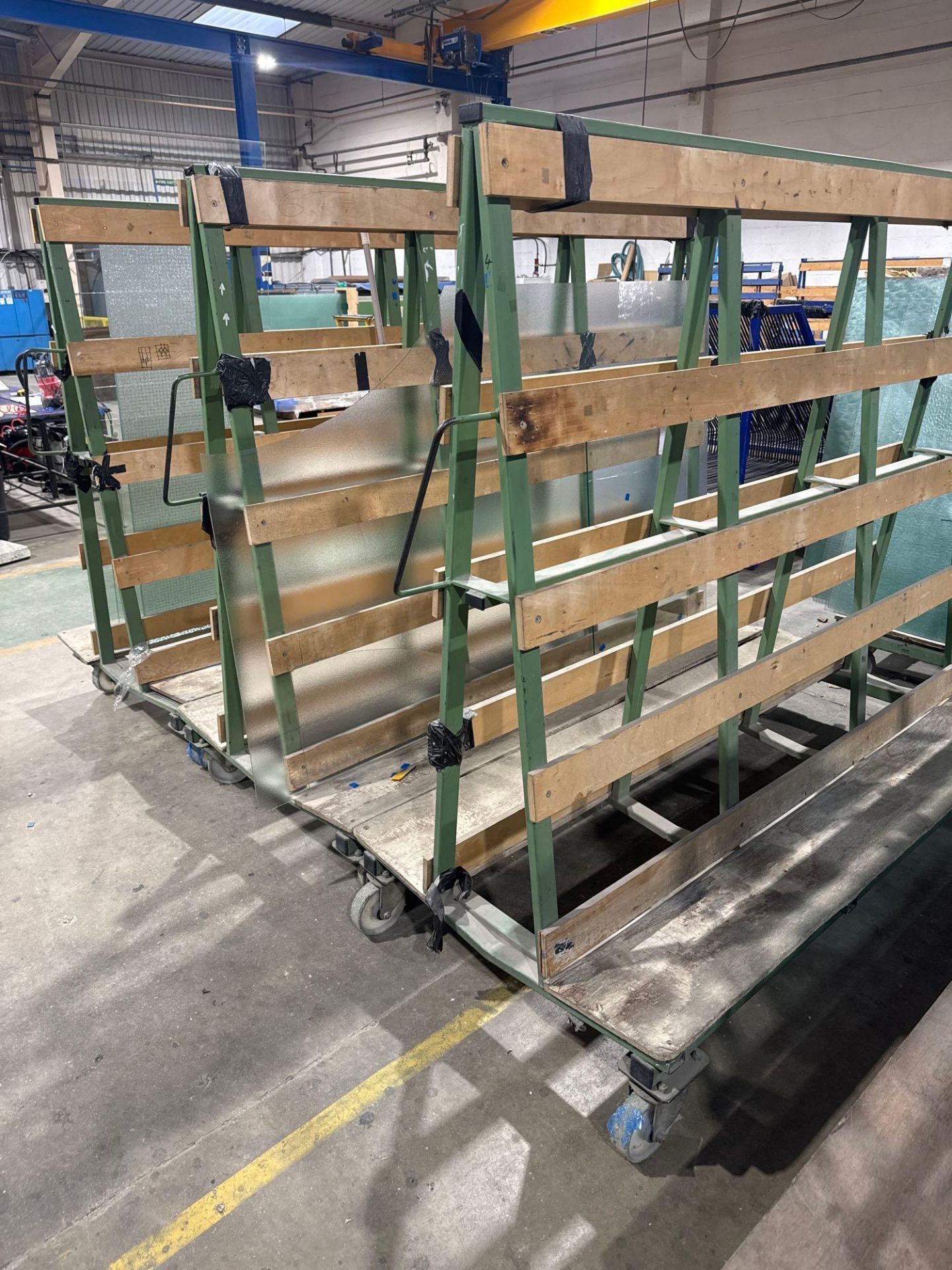 Three steel A frame mobile glass carts