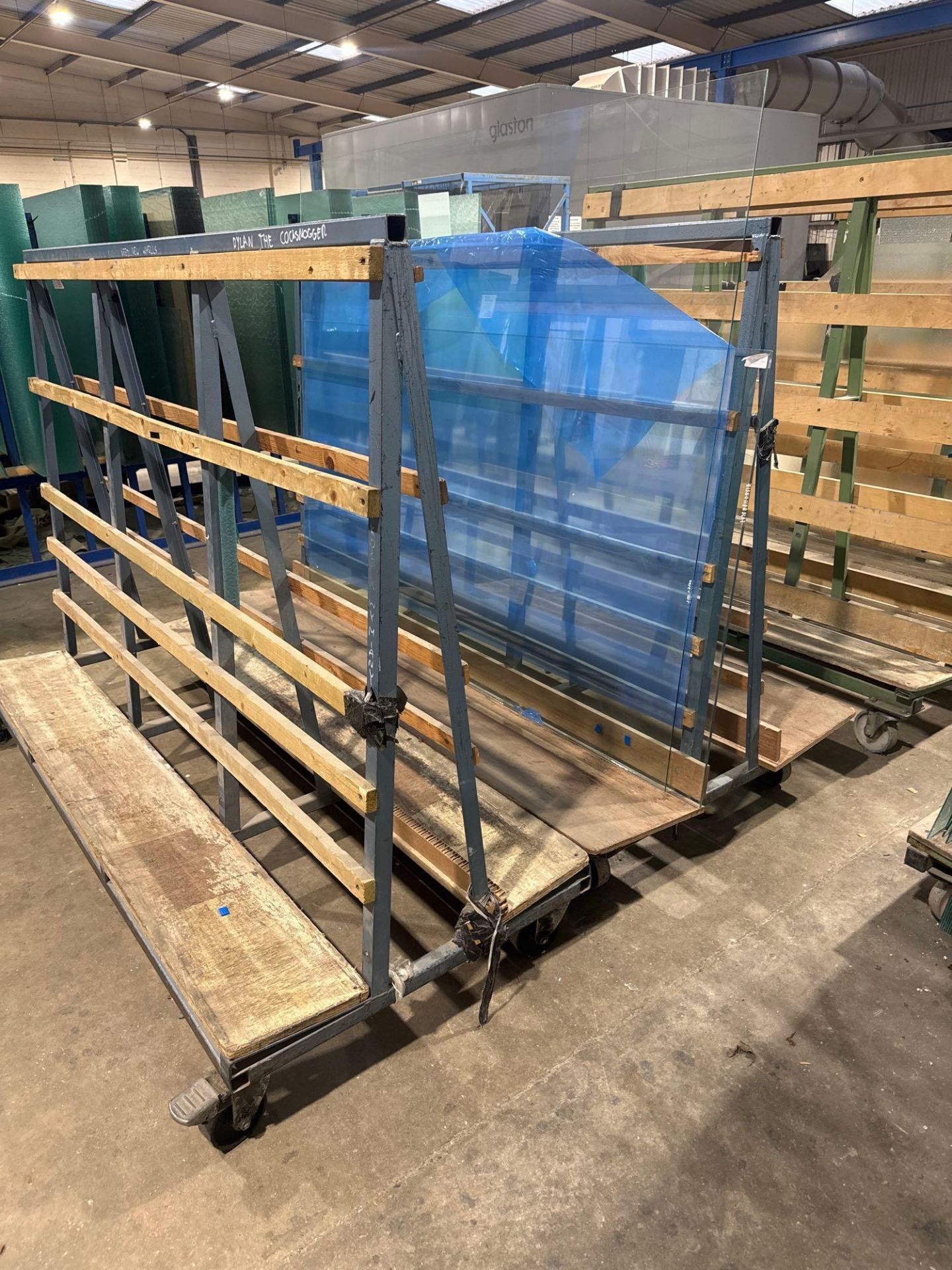 Two steel A frame mobile glass carts