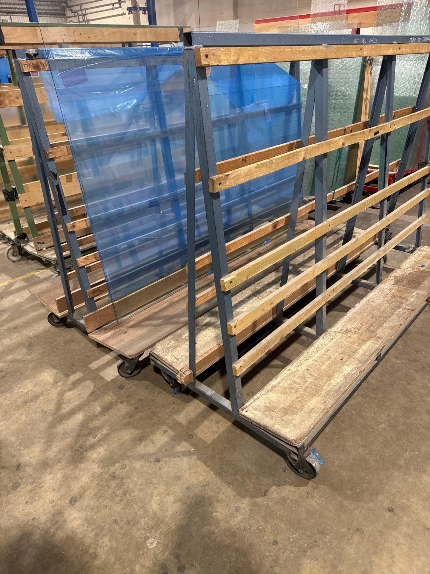 Two steel A frame mobile glass carts