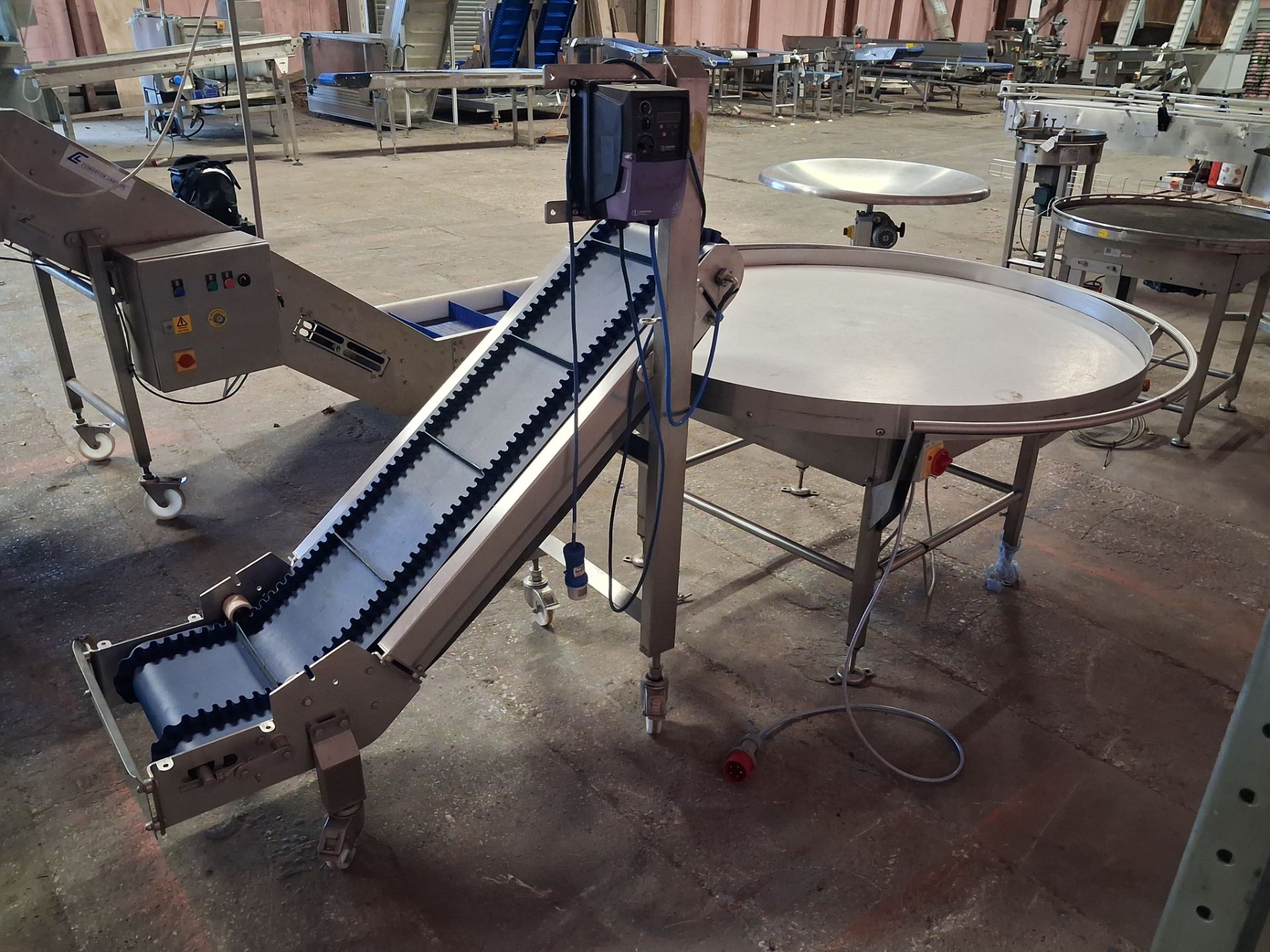 Combination Lazy susan and stainless steel feed conveyor. 2018 Syspal ...