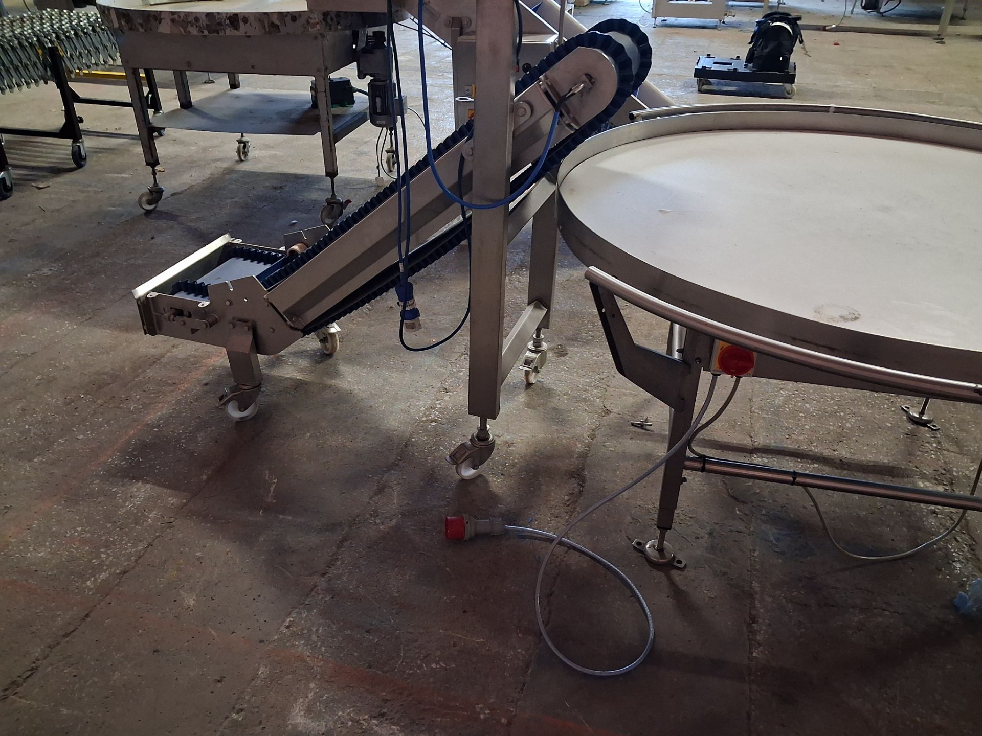 Combination Lazy susan and stainless steel feed conveyor. 2018 Syspal ...