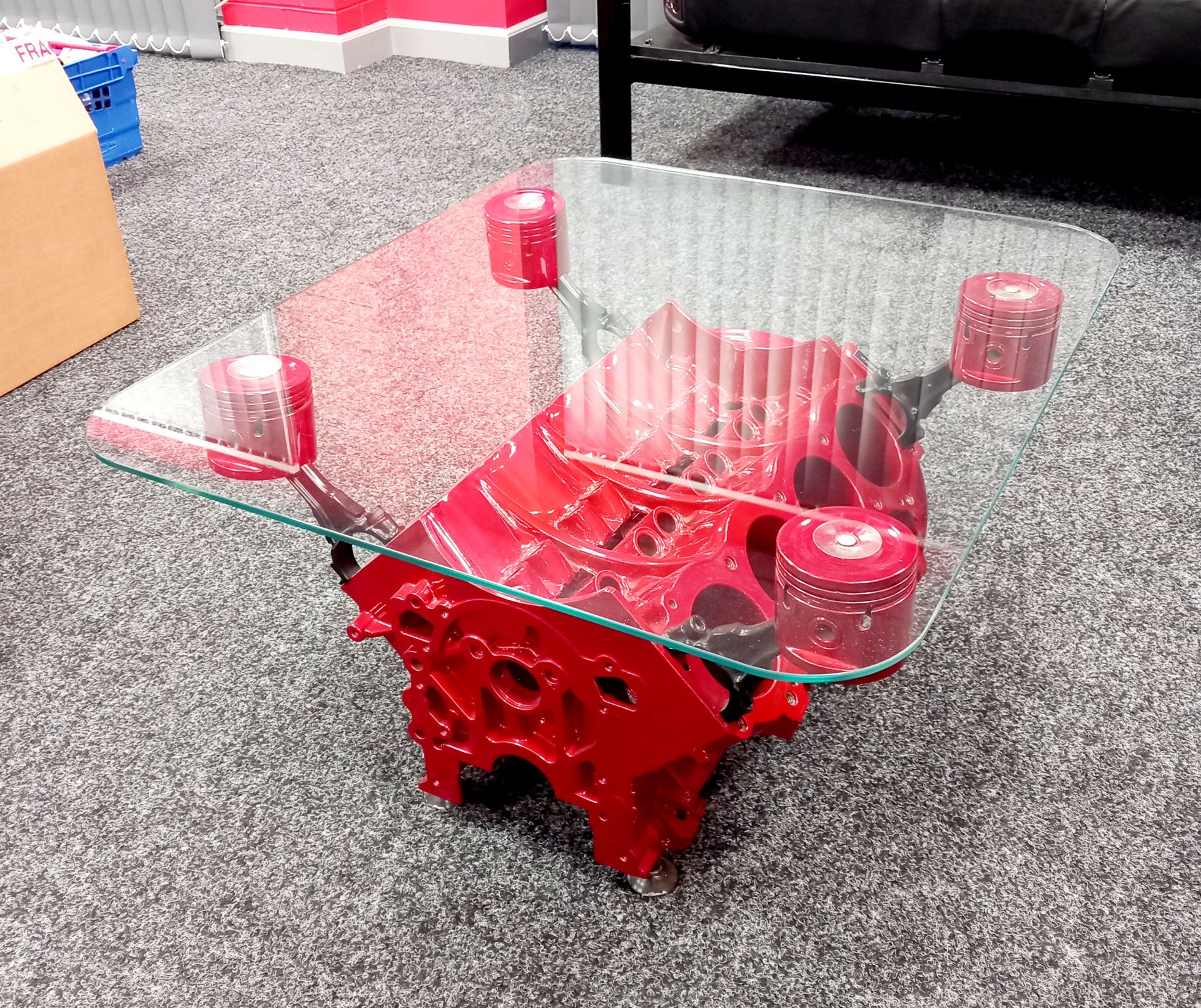 Red V8 engine glass top table