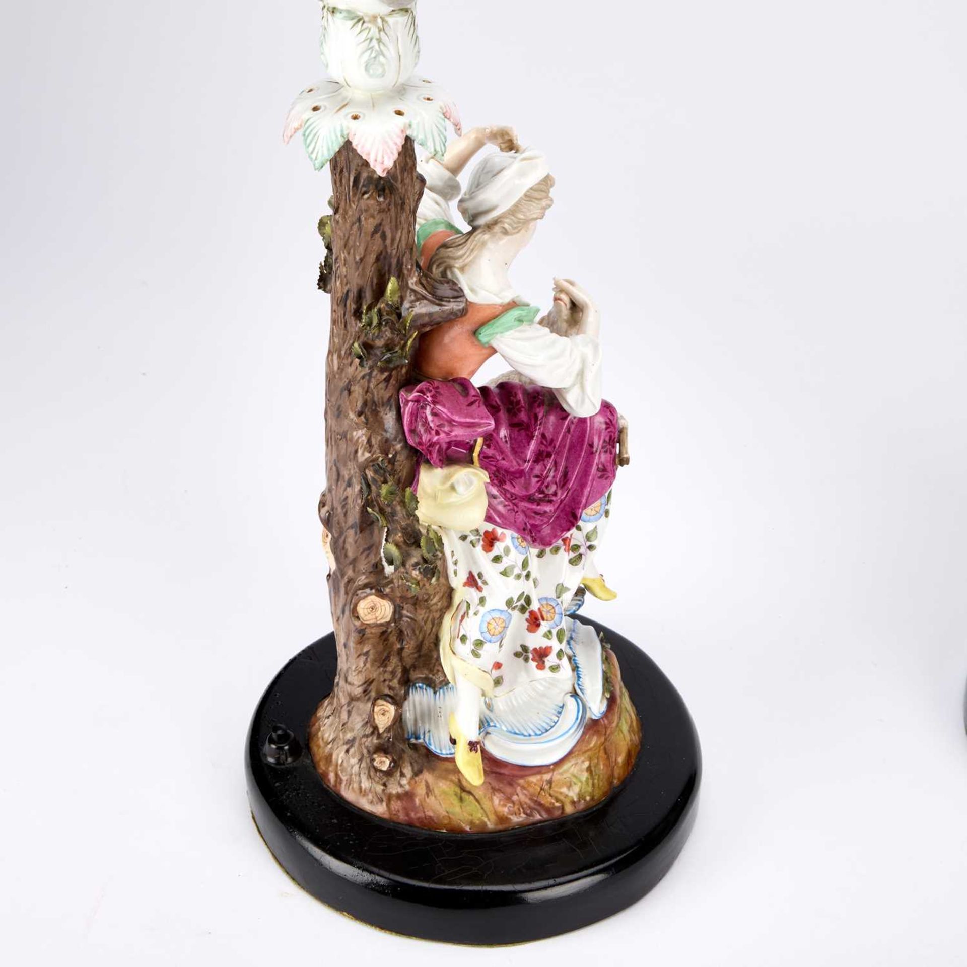 A PAIR OF CONTINENTAL PORCELAIN FIGURAL TABLE LAMPS modelled as a ...