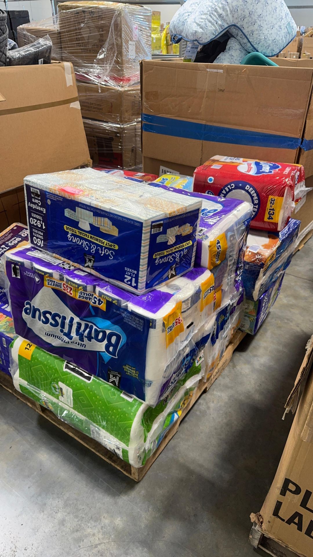 pallet of toilet paper, paper towels and Kleenex