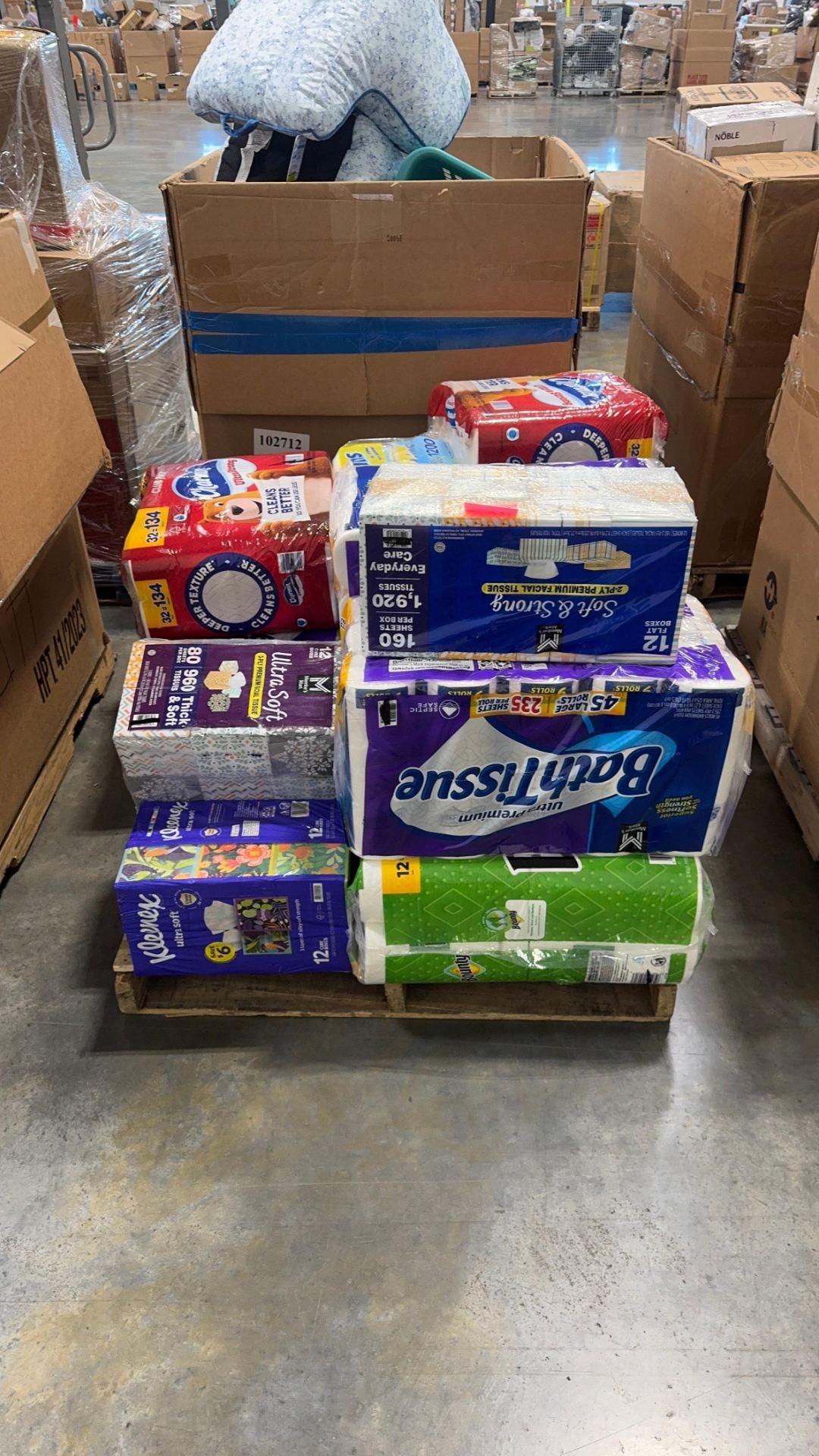 pallet of toilet paper, paper towels and Kleenex