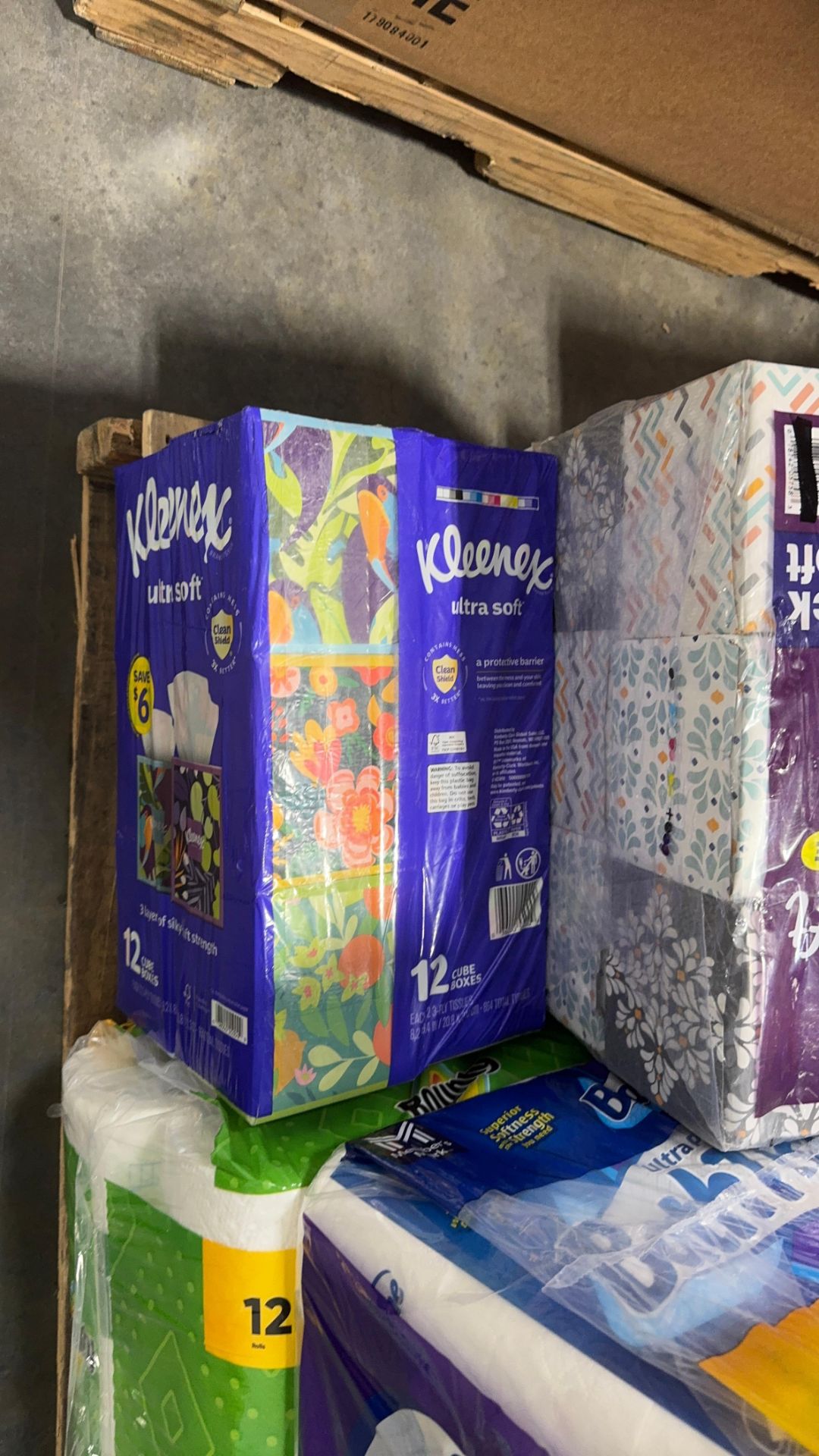 pallet of toilet paper, paper towels and Kleenex